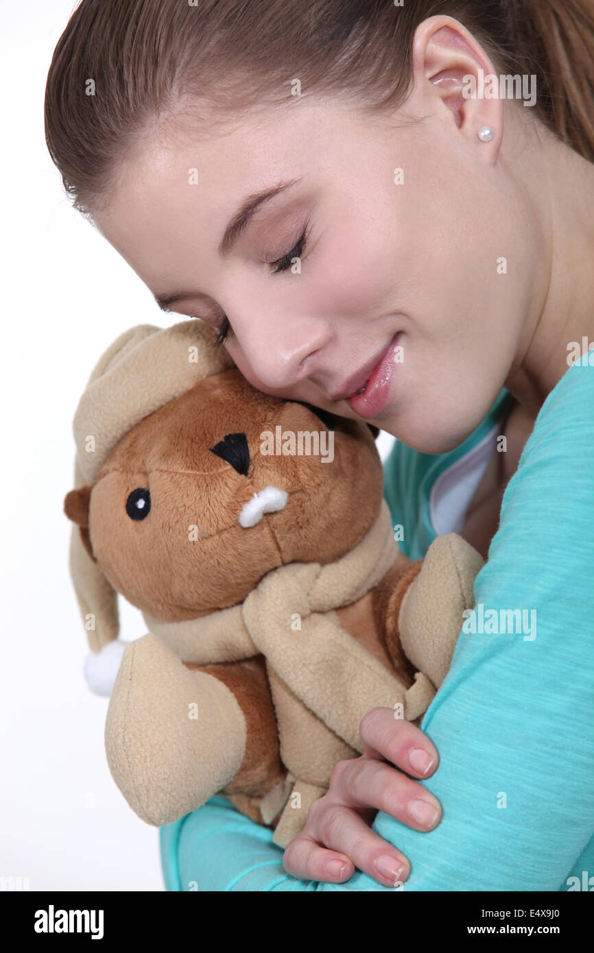 Woman hugging cuddly toy Stock Photo - Alamy