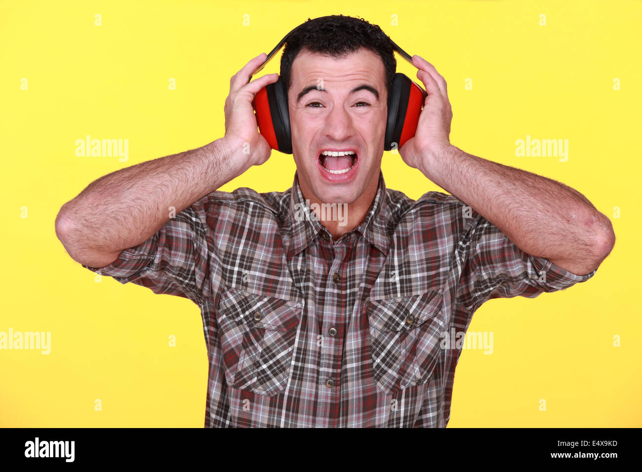 Builder wearing hearing protection Stock Photo - Alamy