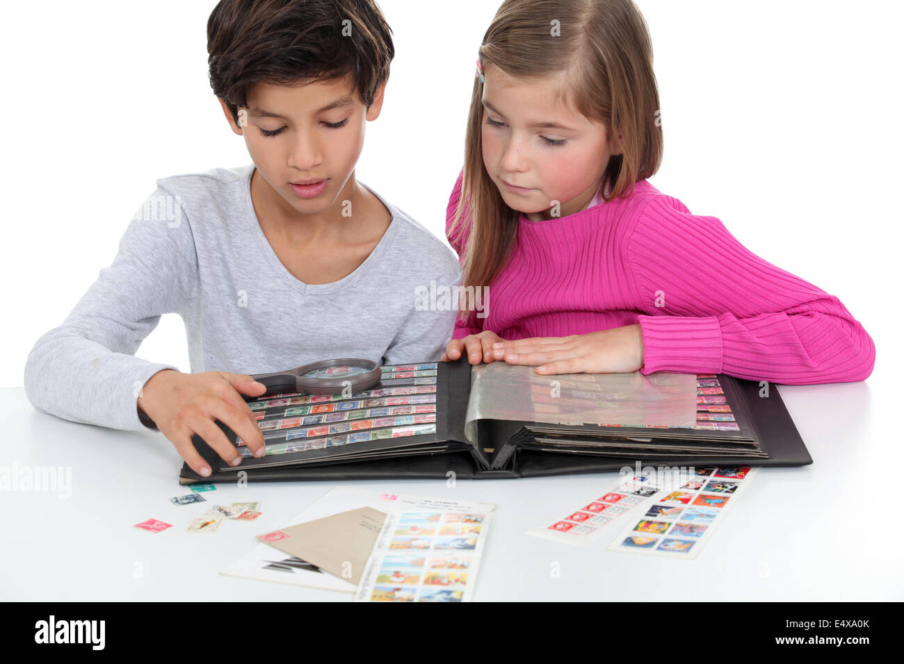 kids and their stamp collection Stock Photo - Alamy