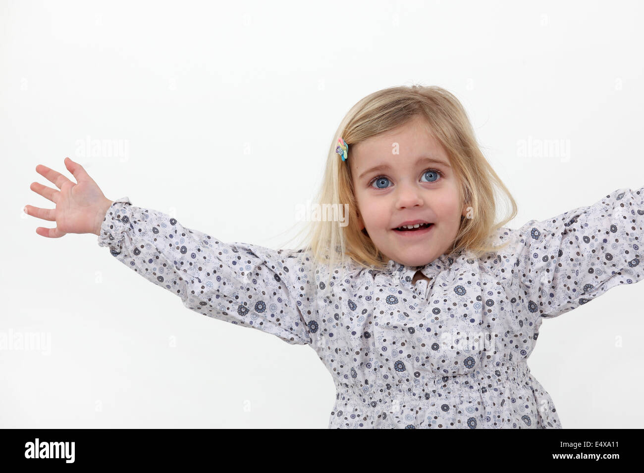 A little girl with stretched arms Stock Photo - Alamy