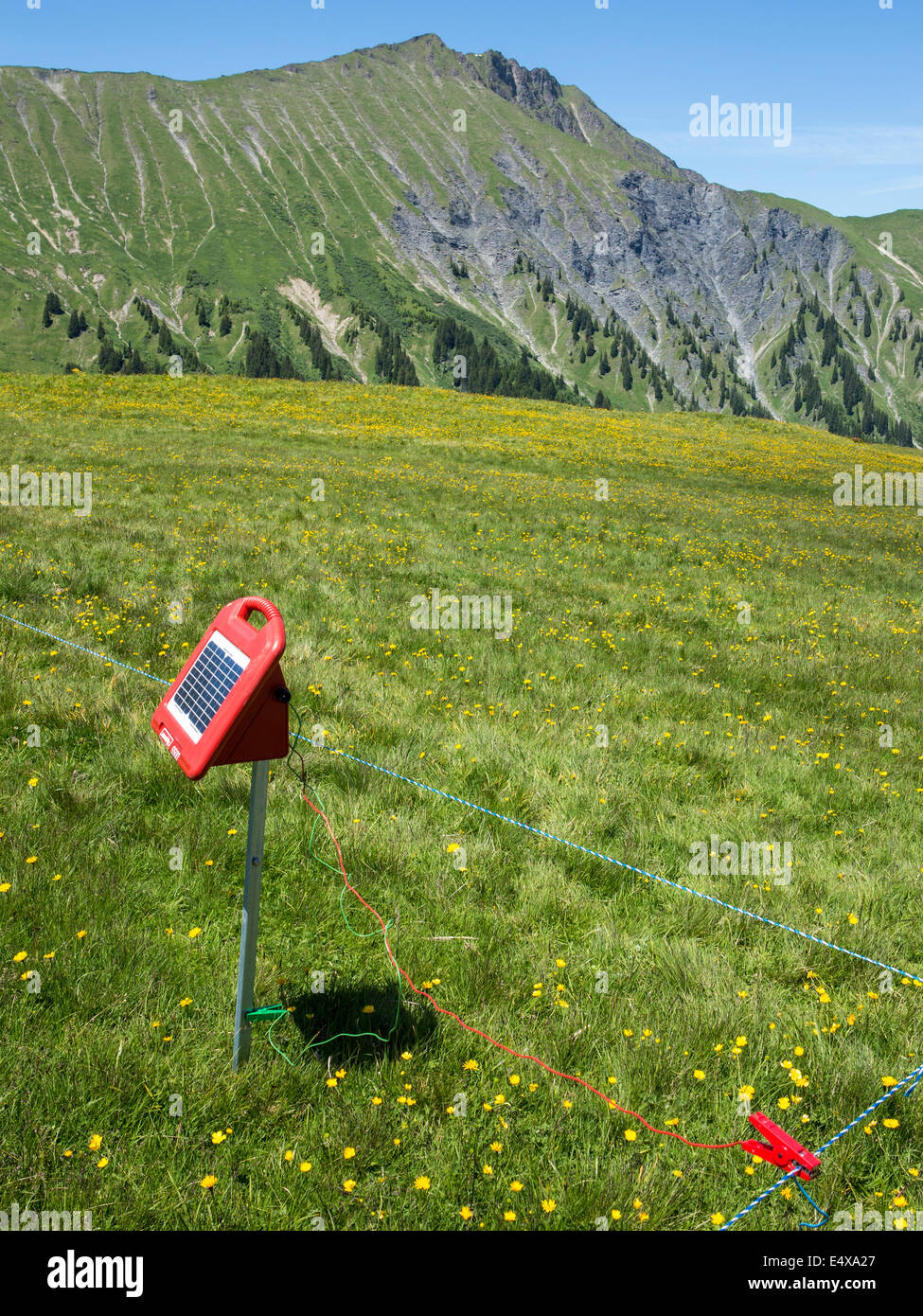 Solar powered electric fence in the Swiss alps Stock Photo - Alamy