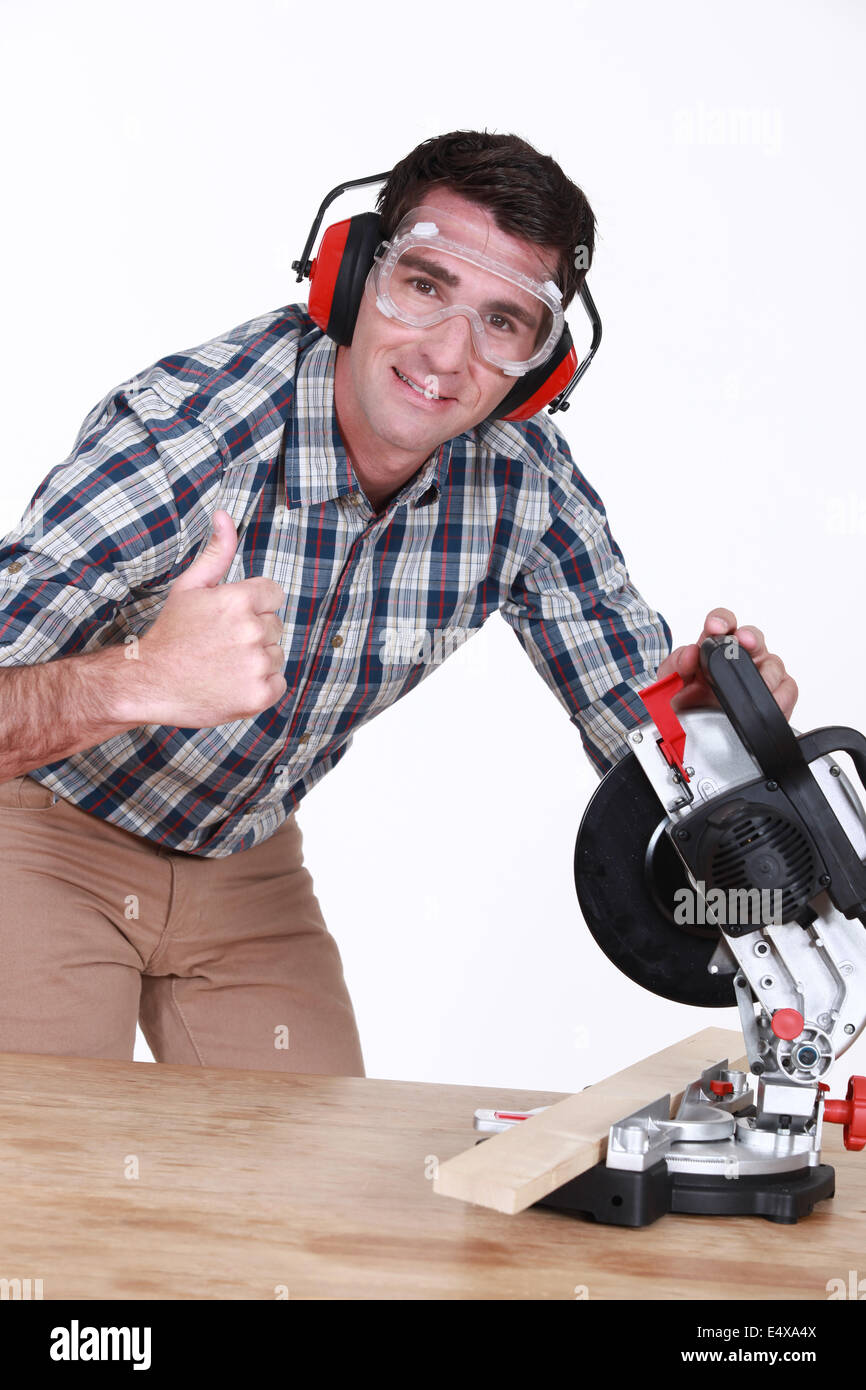 Man using a mitre saw Stock Photo - Alamy