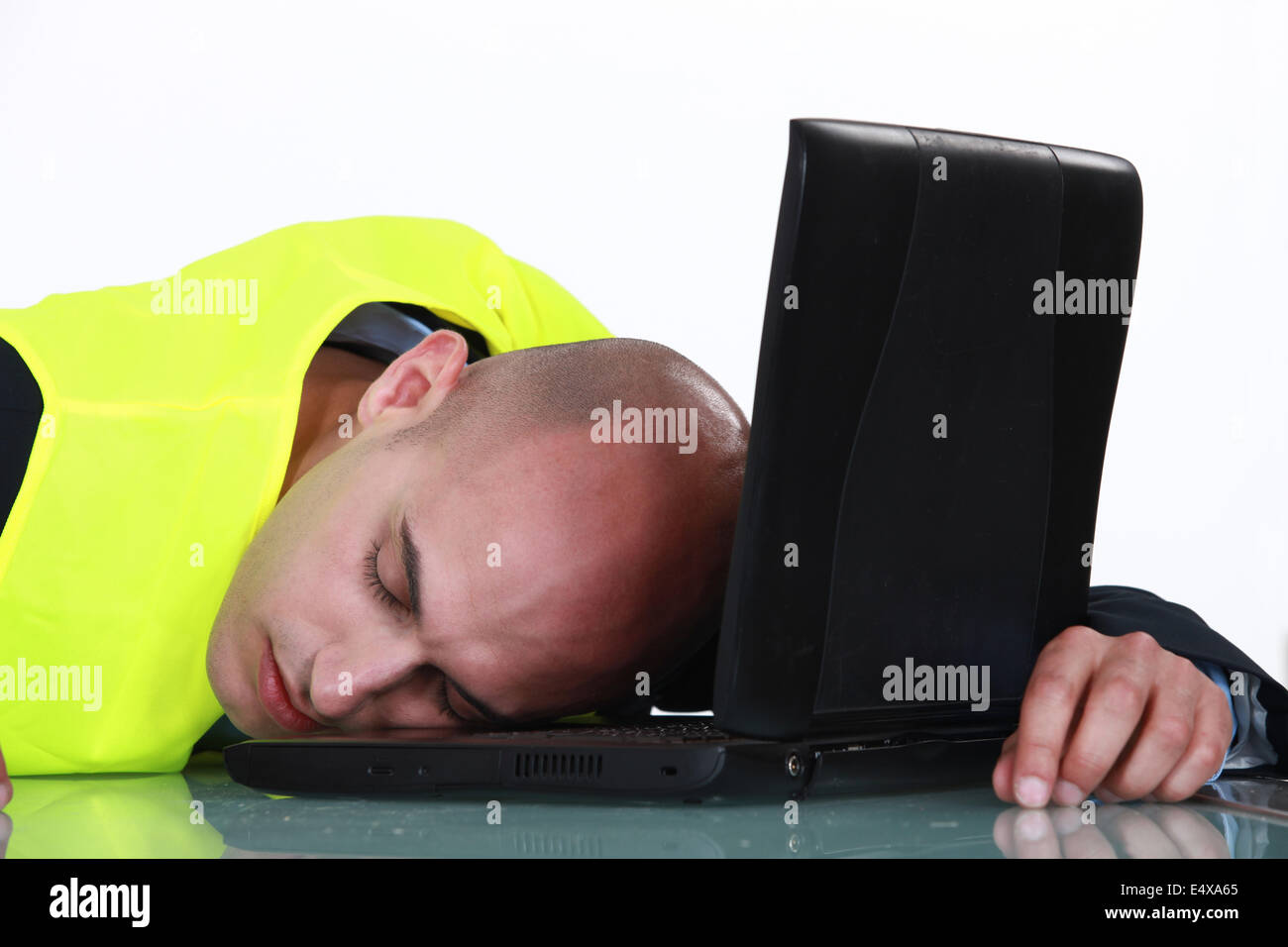 Laborer sleeping on a computer Stock Photo - Alamy