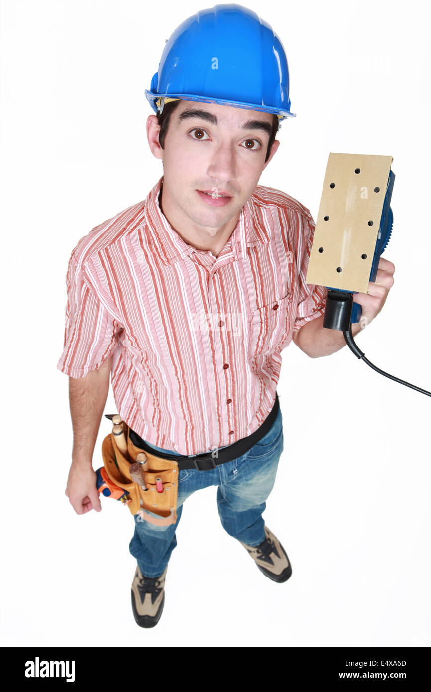 Man holding an electric tool Stock Photo - Alamy