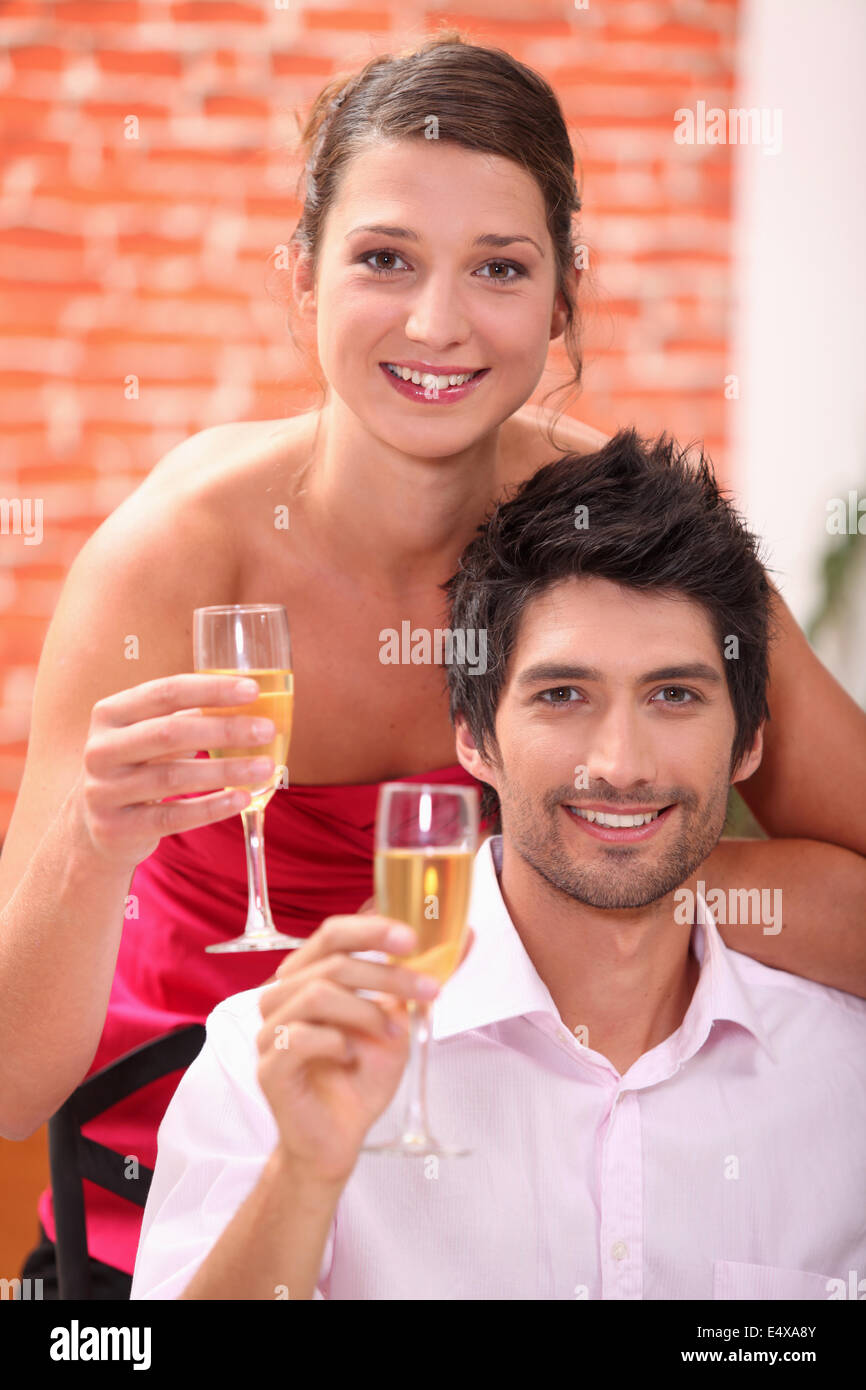 Elegant couple drinking champagne Stock Photo - Alamy