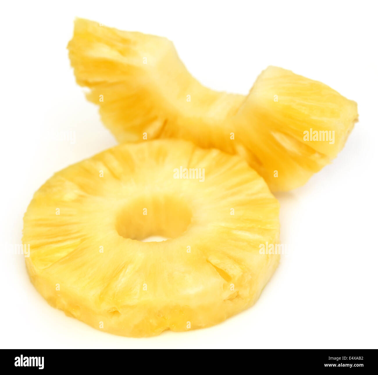 pineapple pieces over white background Stock Photo - Alamy