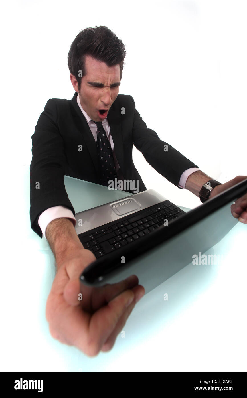 A businessman angry at his laptop Stock Photo - Alamy