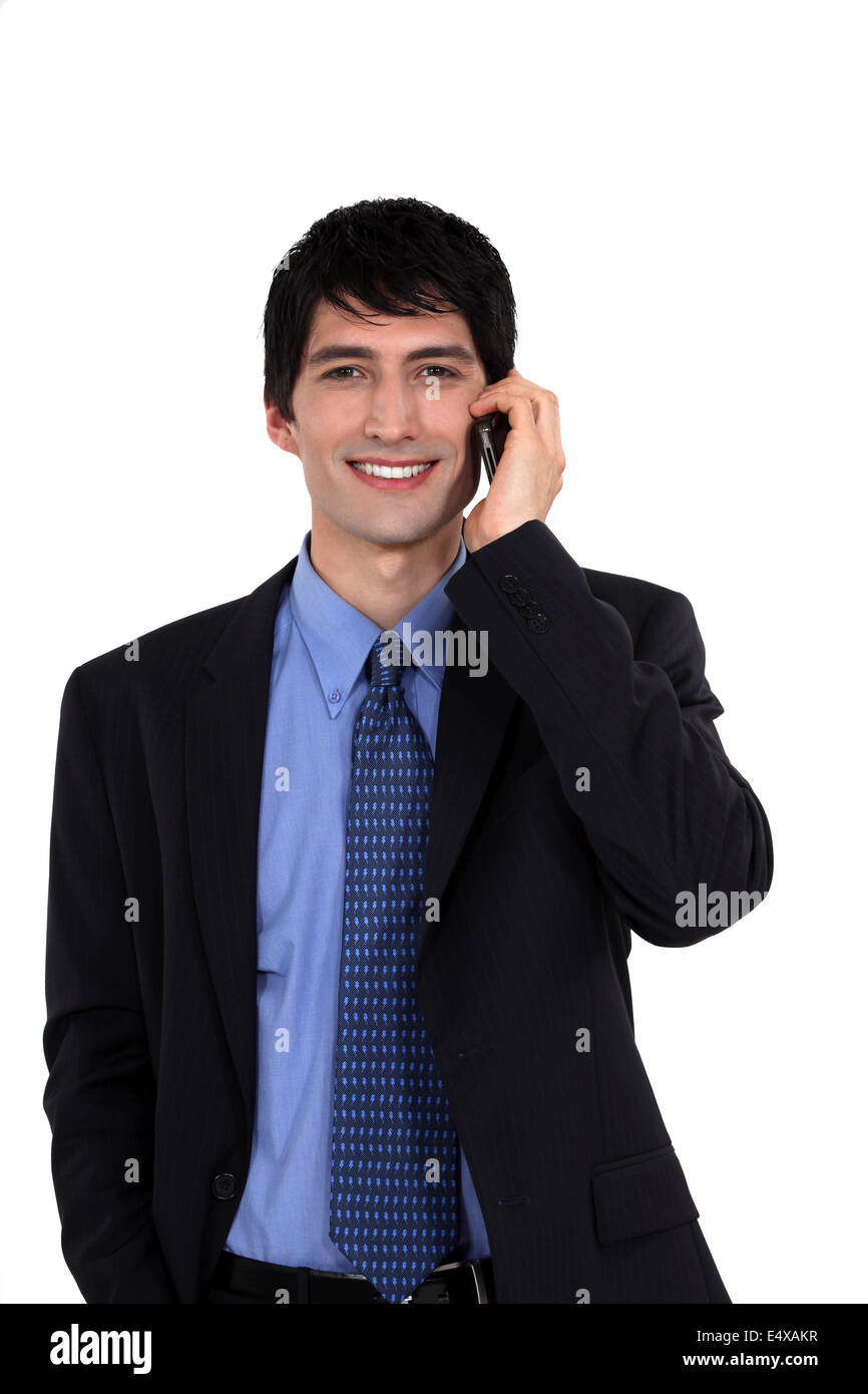 Casual businessman making call Stock Photo - Alamy