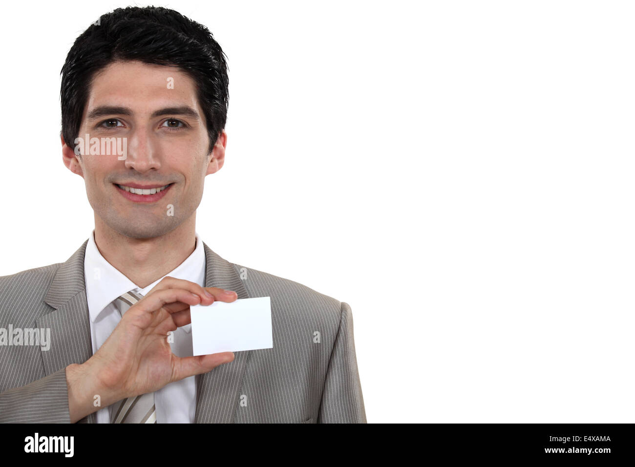 Businessman holding up his business card Stock Photo - Alamy