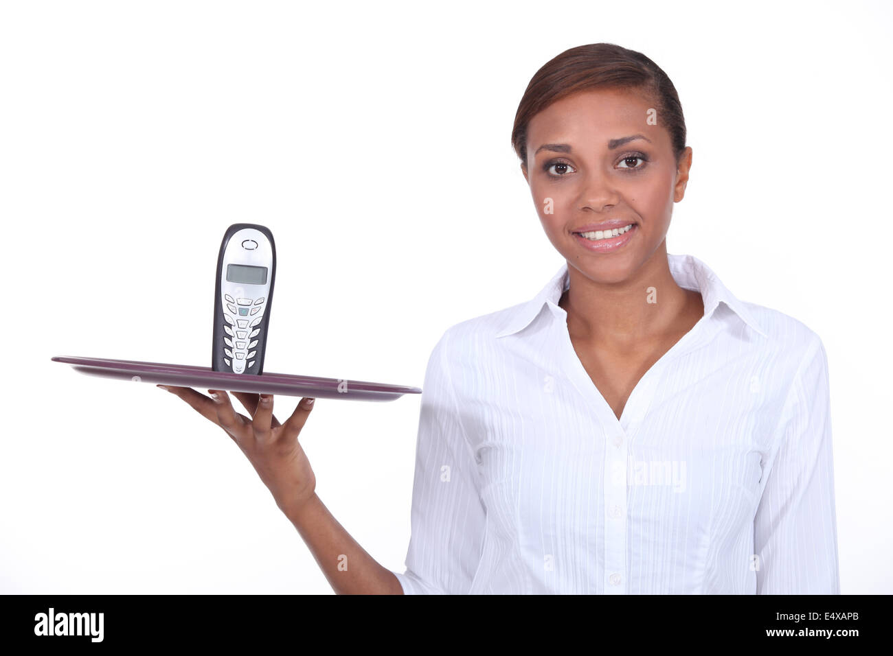 waitress with telephone on a tray Stock Photo - Alamy