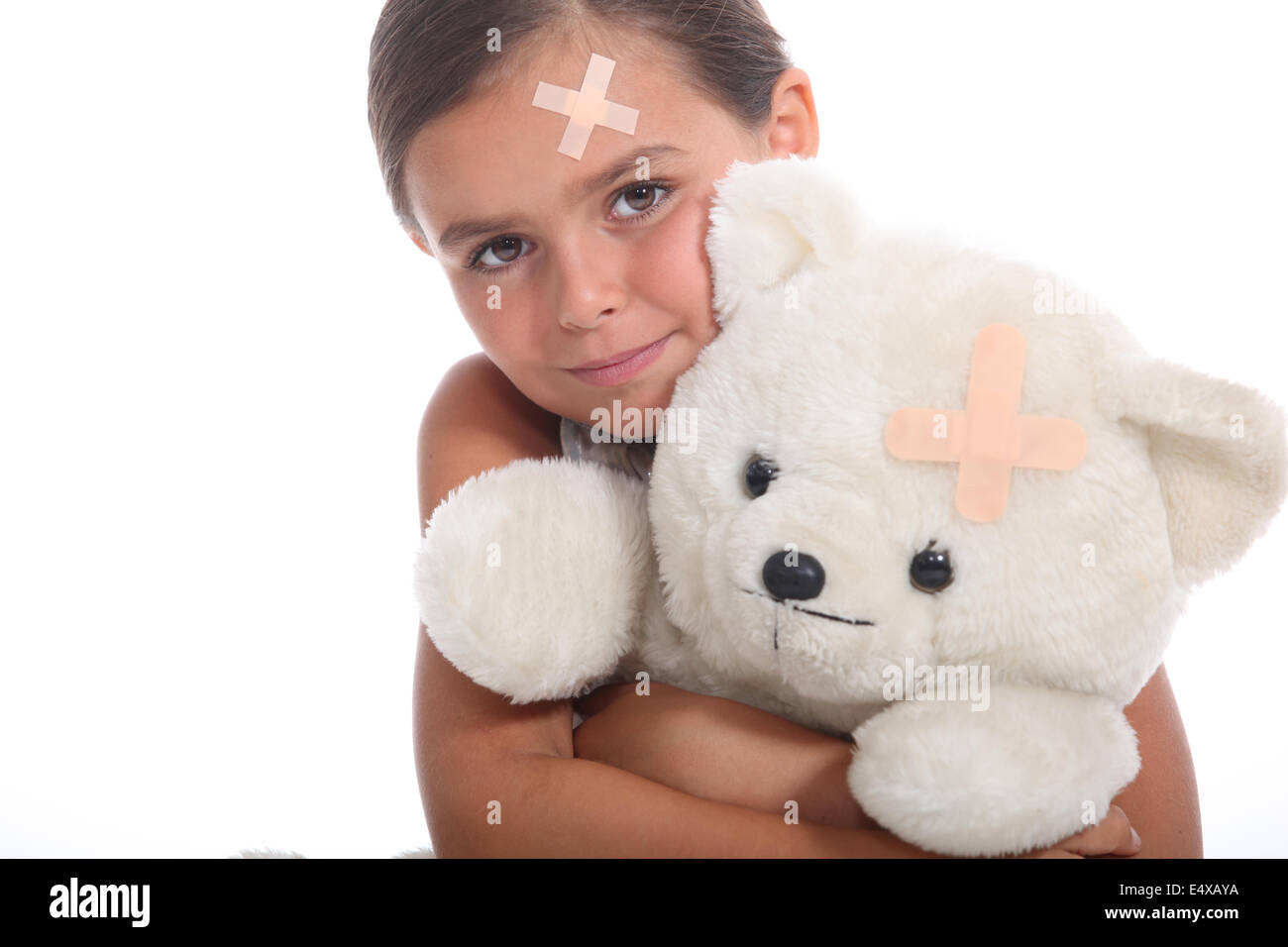 Girl and teddy with a plaster Stock Photo - Alamy