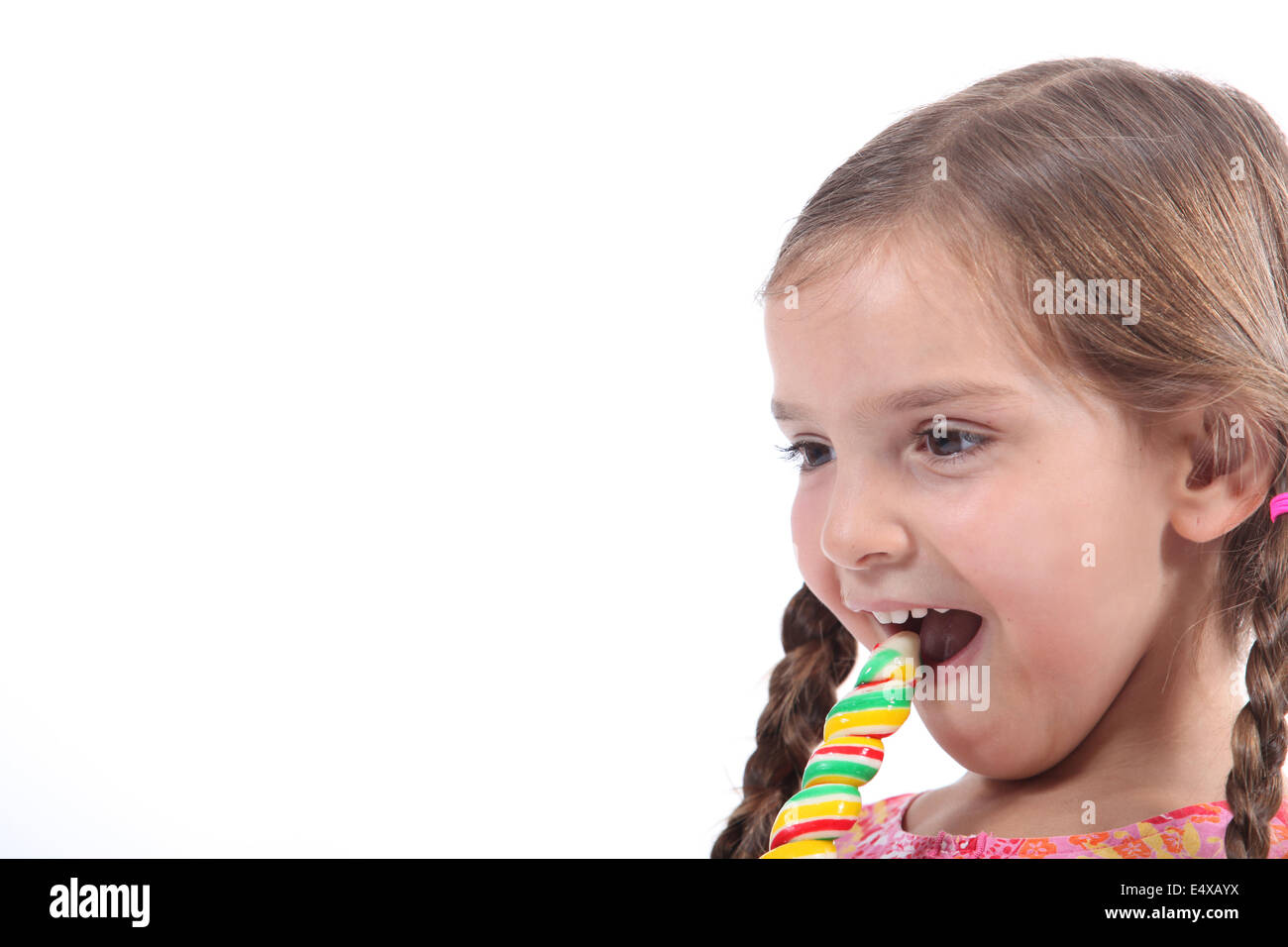 Little girl eating fruit hi-res stock photography and images - Alamy