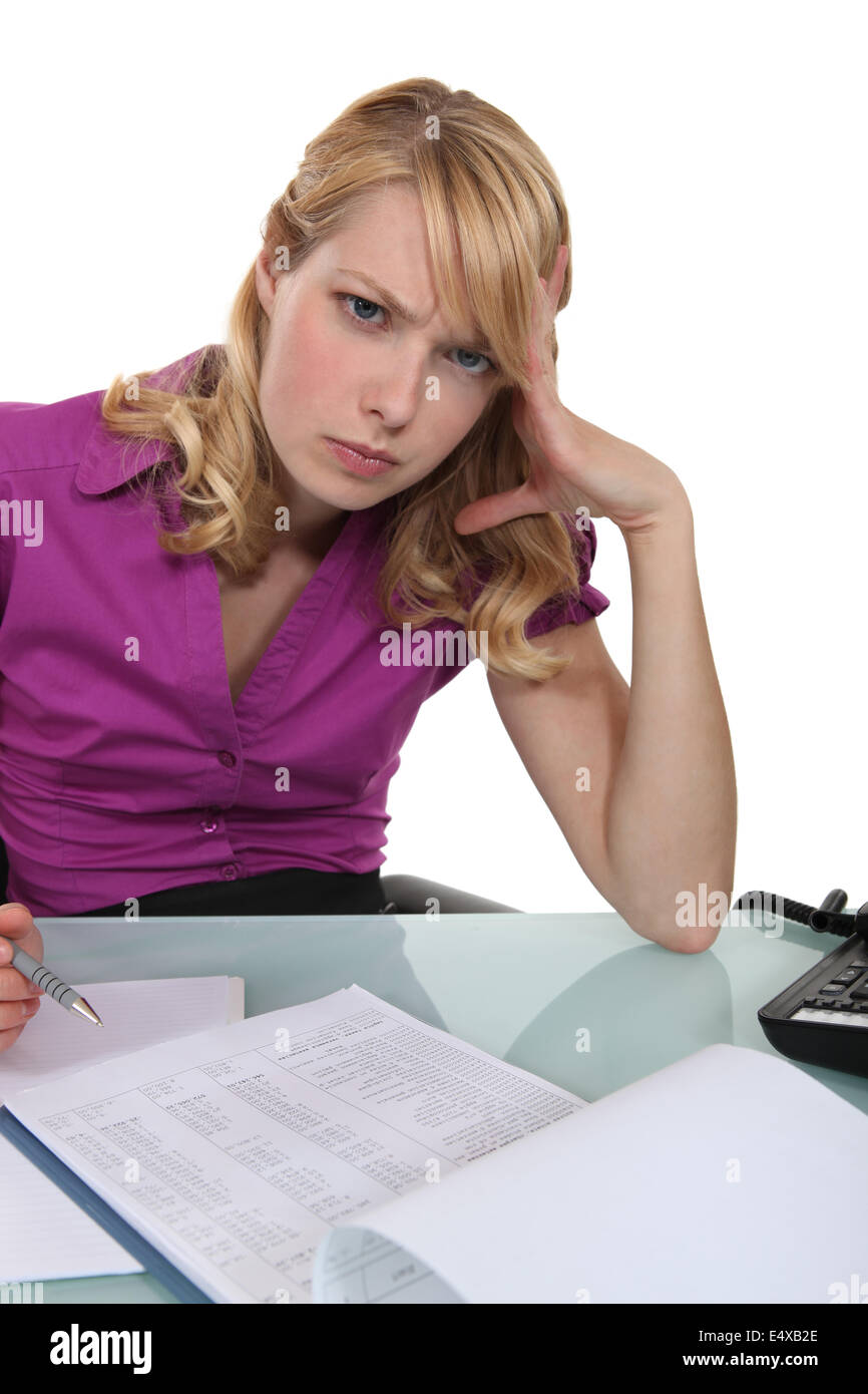 angry secretary working at her desk Stock Photo - Alamy