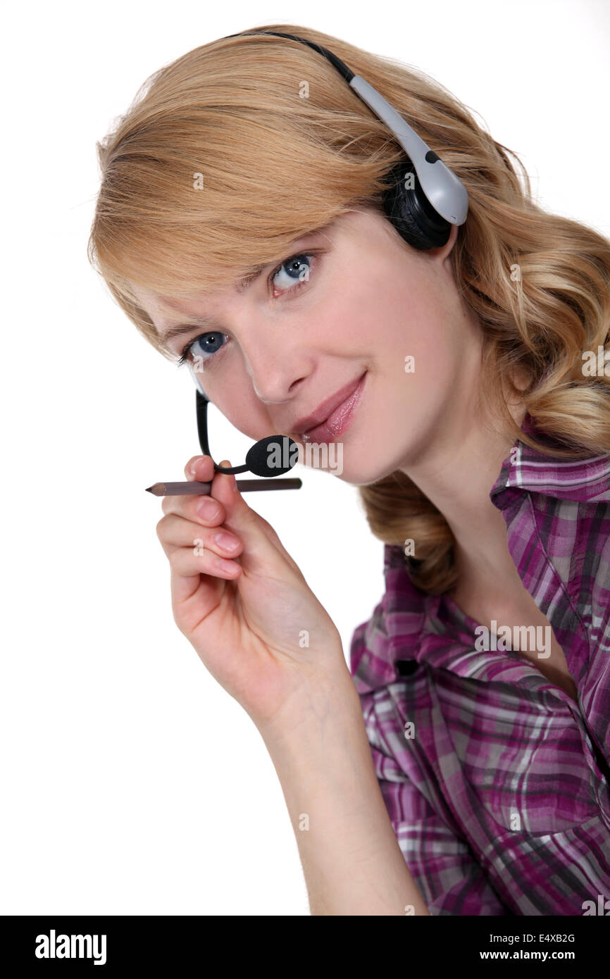 Receptionist wearing telephone head-set Stock Photo - Alamy