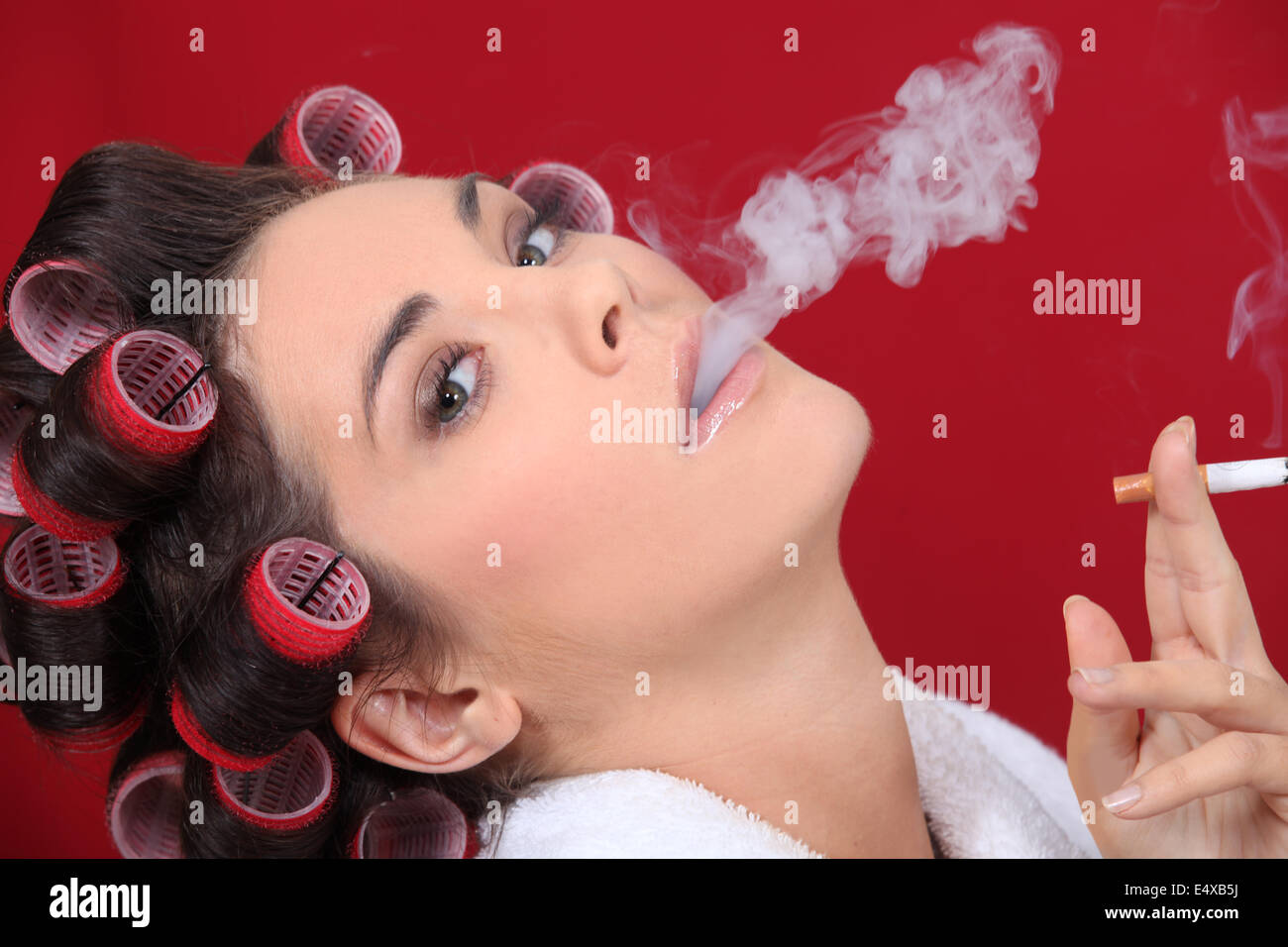 woman with curlers in her hair smoking Stock Photo - Alamy