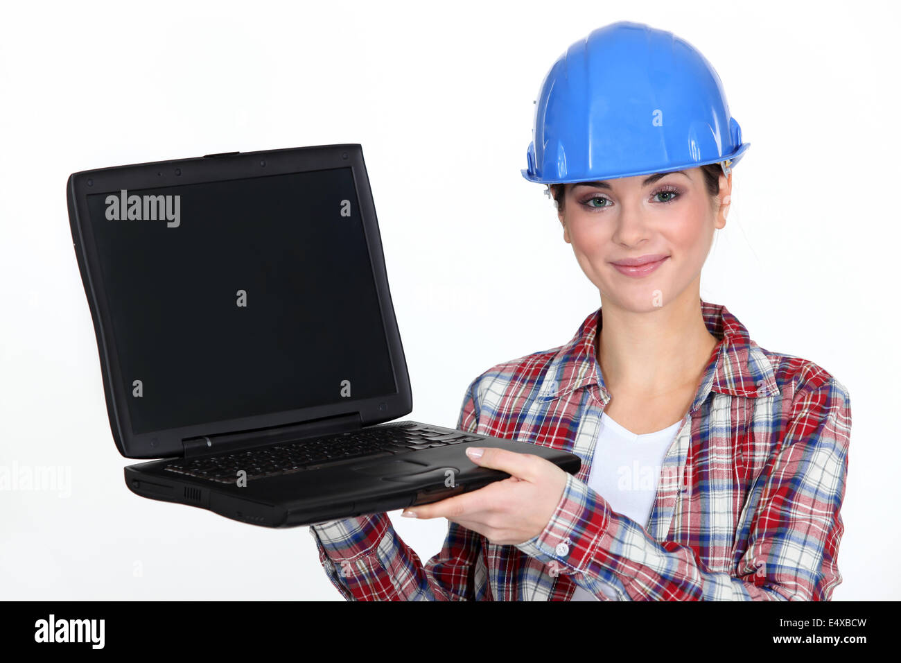 Female contractor holding laptop Stock Photo - Alamy