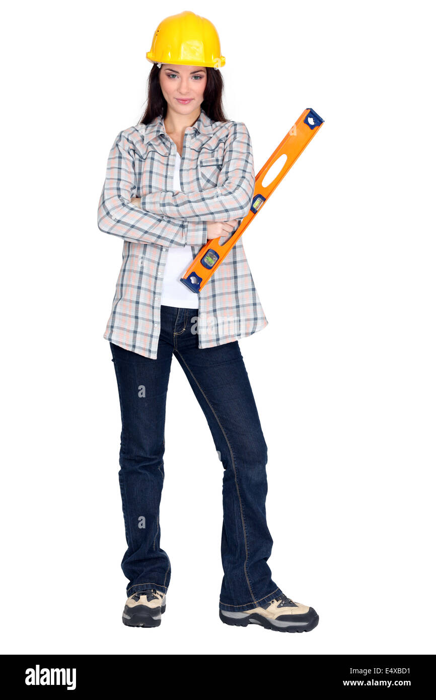 Woman with spirit level Stock Photo - Alamy