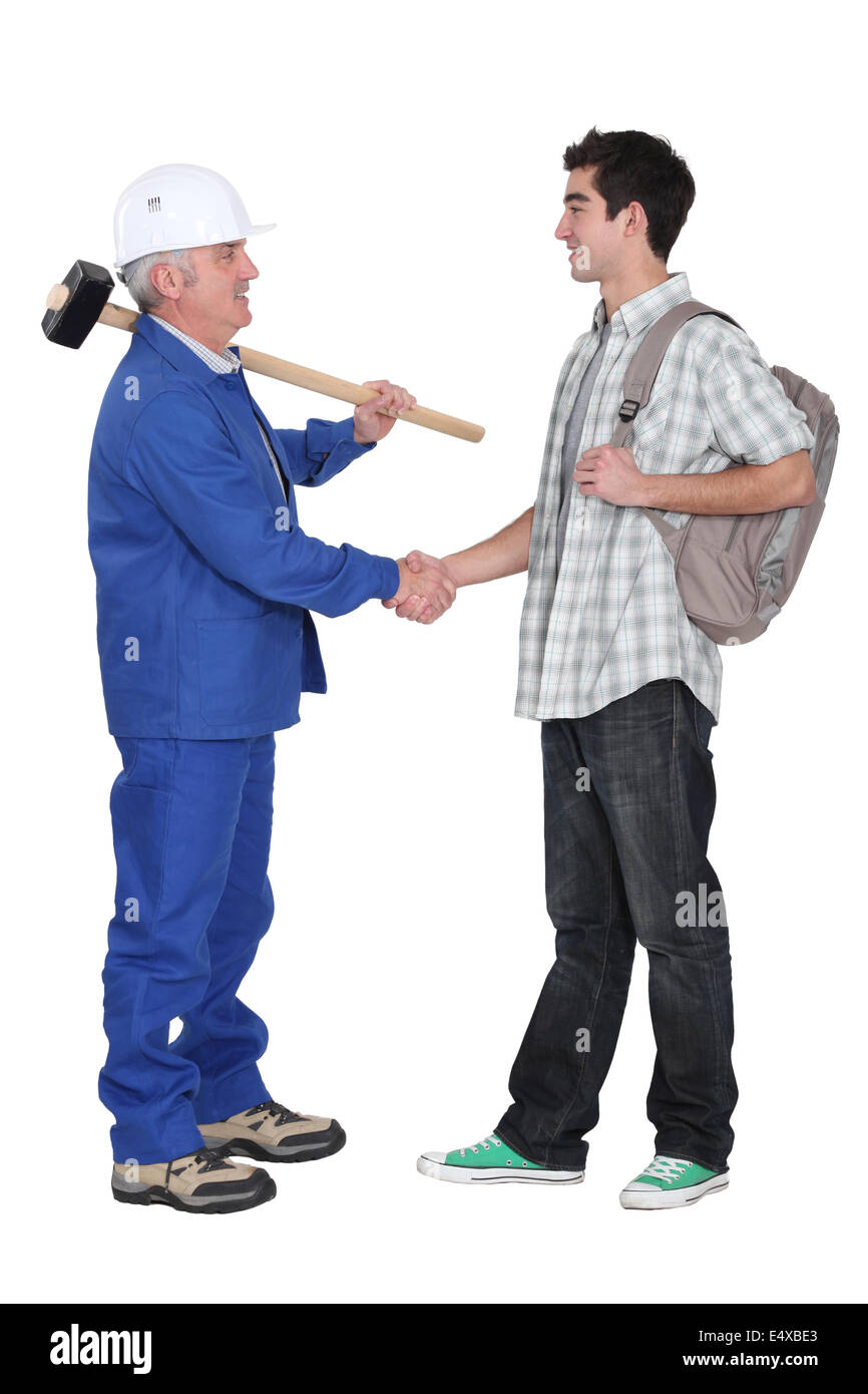 Apprentice builder with mentor Stock Photo - Alamy