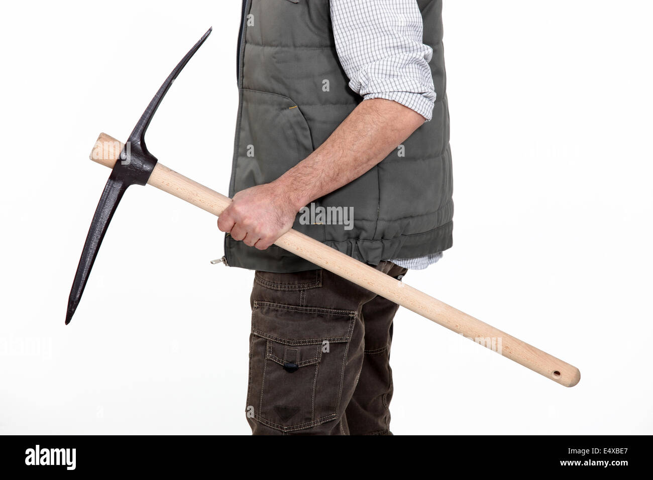 bricklayer holding pickaxe in studio Stock Photo - Alamy