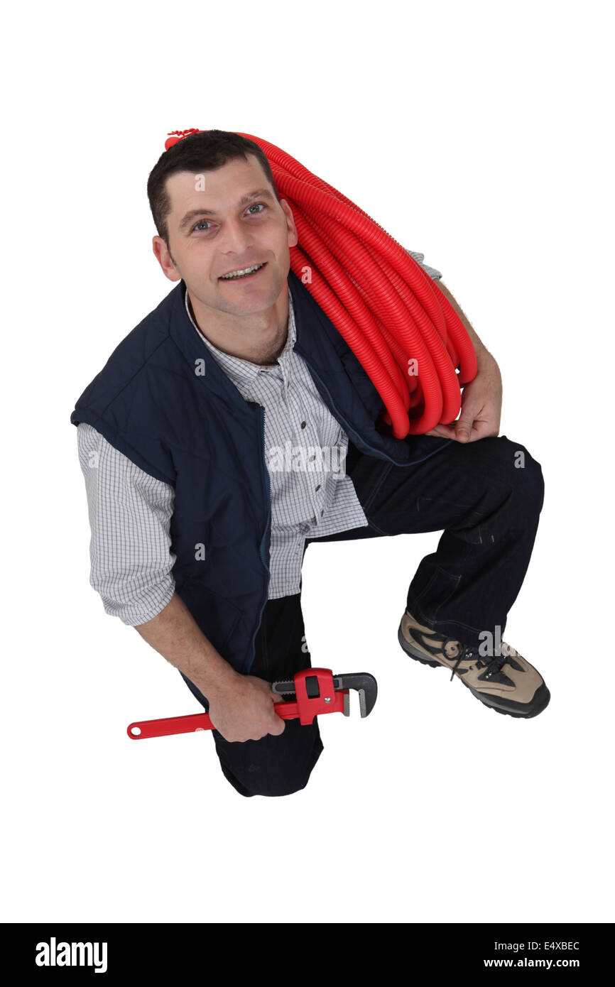 Plumber with pipe Stock Photo - Alamy