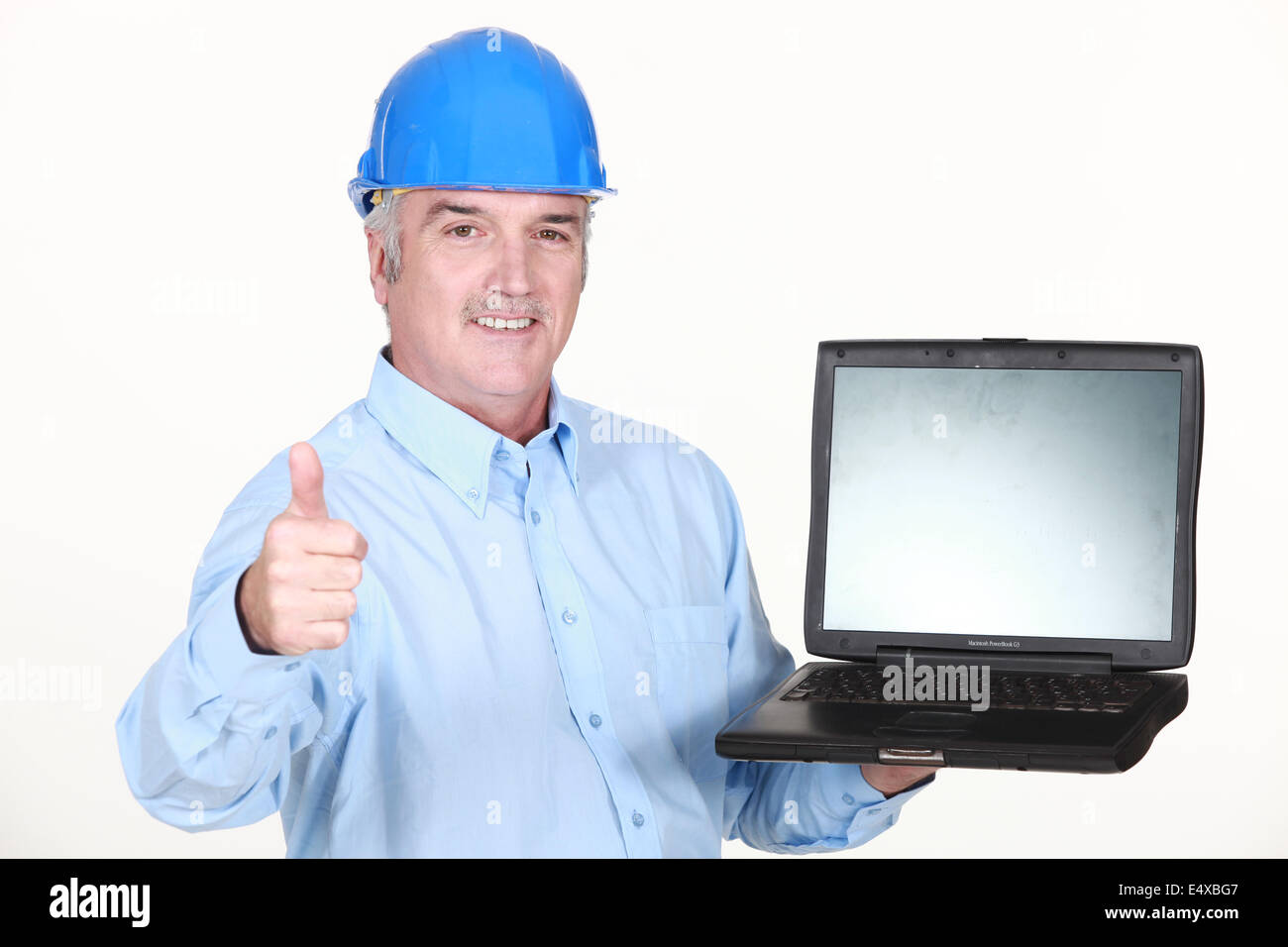 Thumbs up from an engineer with a laptop Stock Photo - Alamy