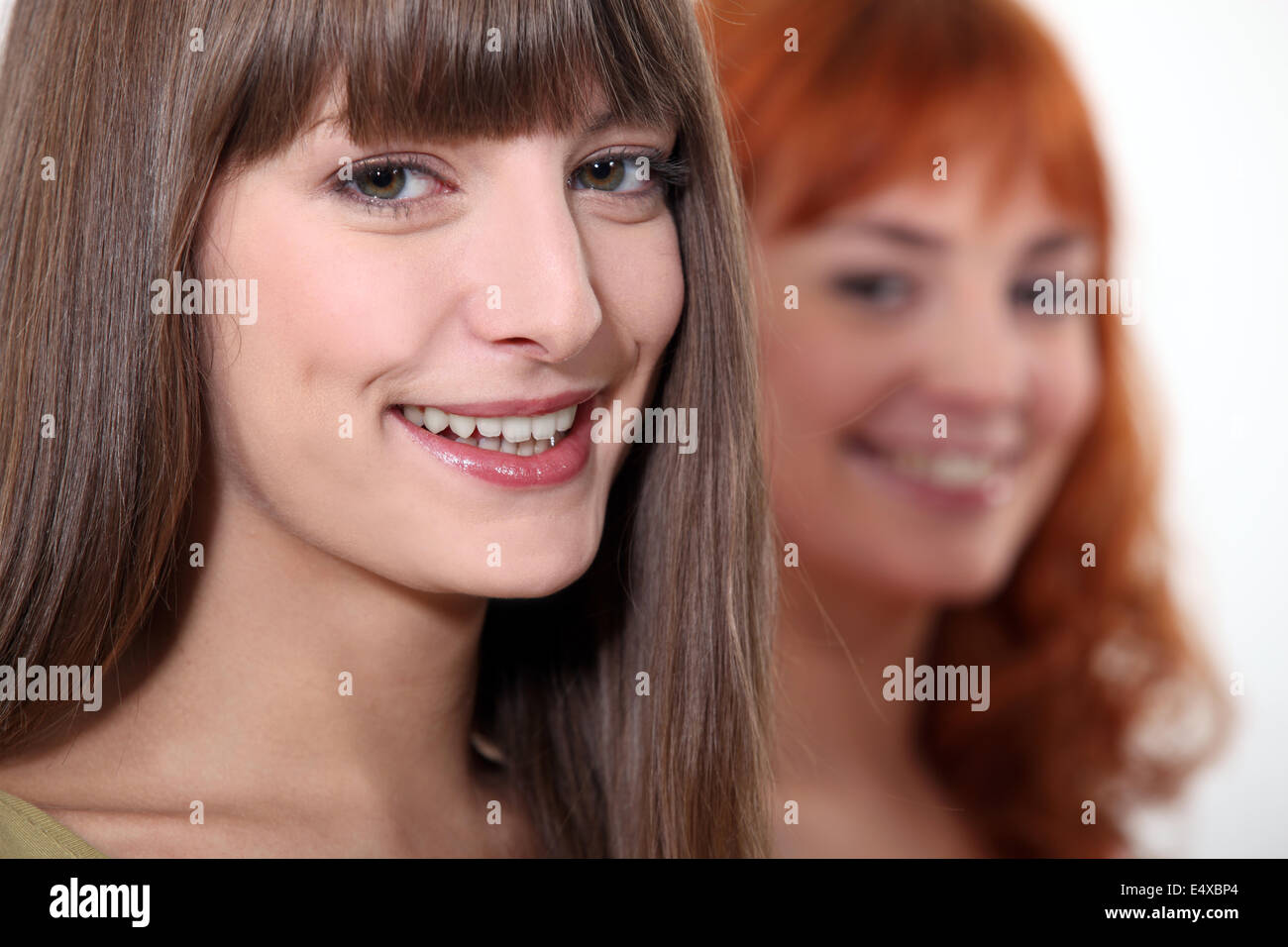 two young women posing Stock Photo - Alamy