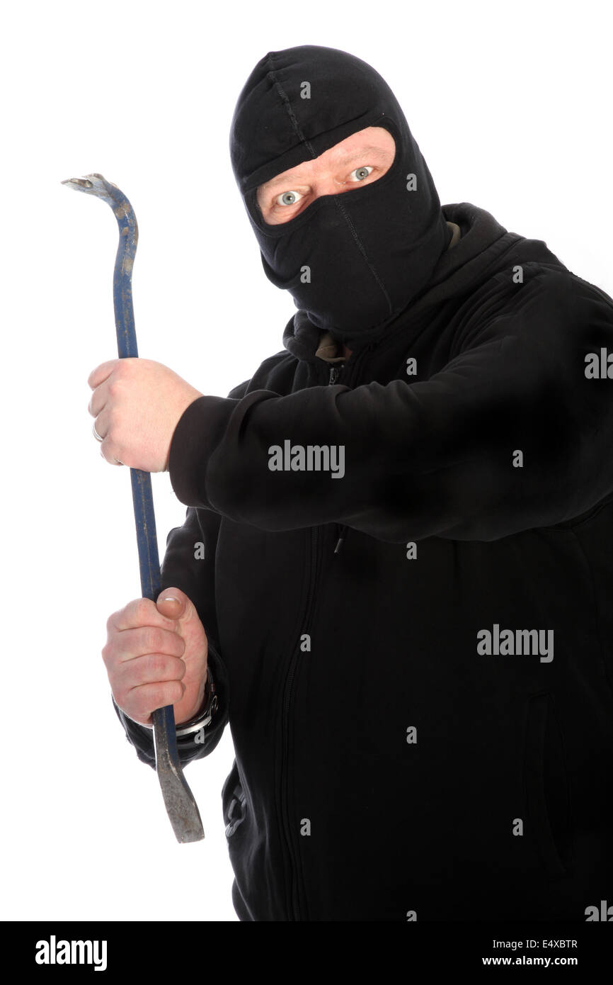 Masked man wielding a crowbar Stock Photo - Alamy