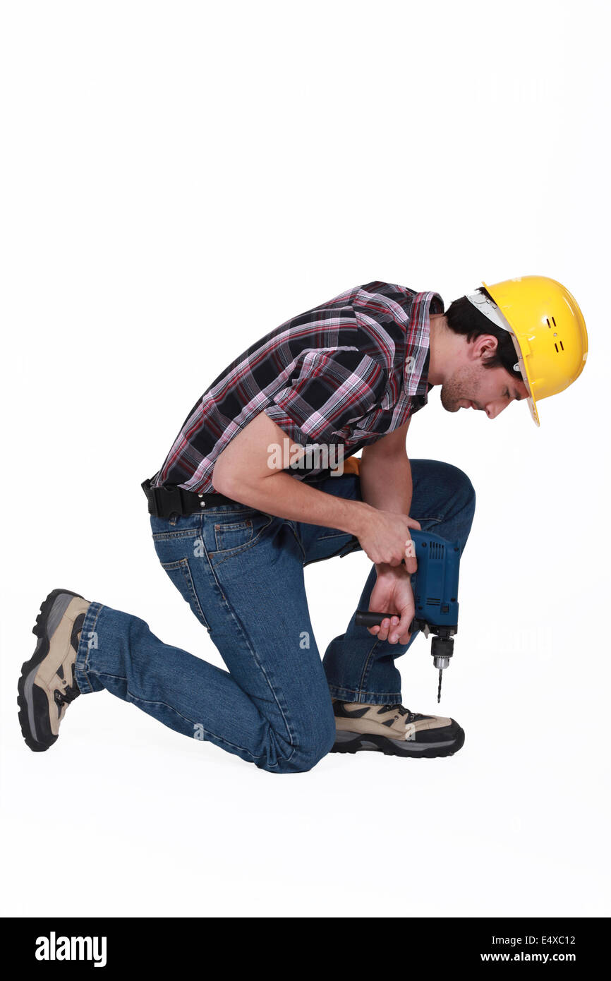 Construction worker with a cordless drill Stock Photo - Alamy