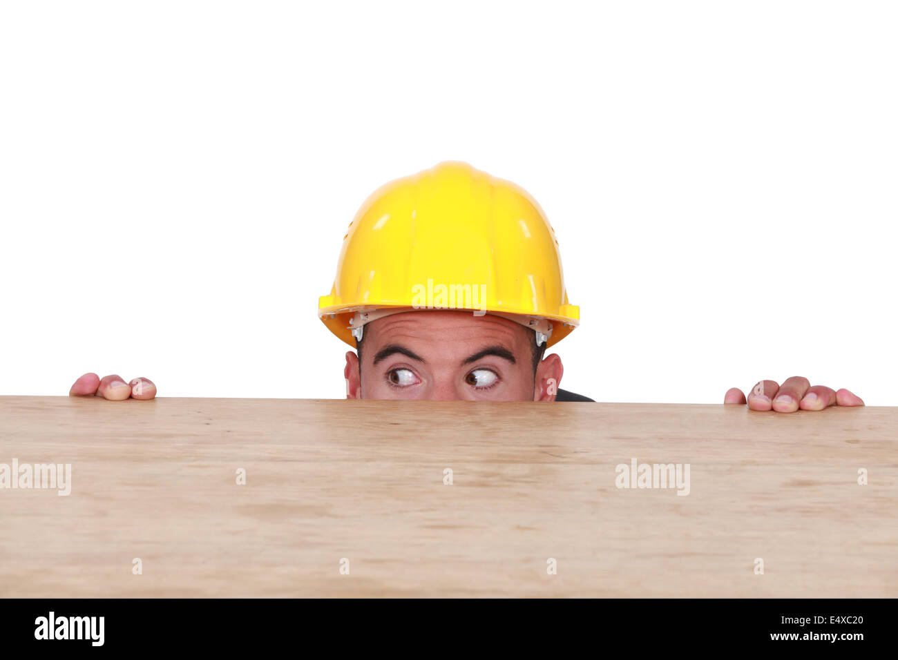Entrepreneur hiding behind a table Stock Photo - Alamy