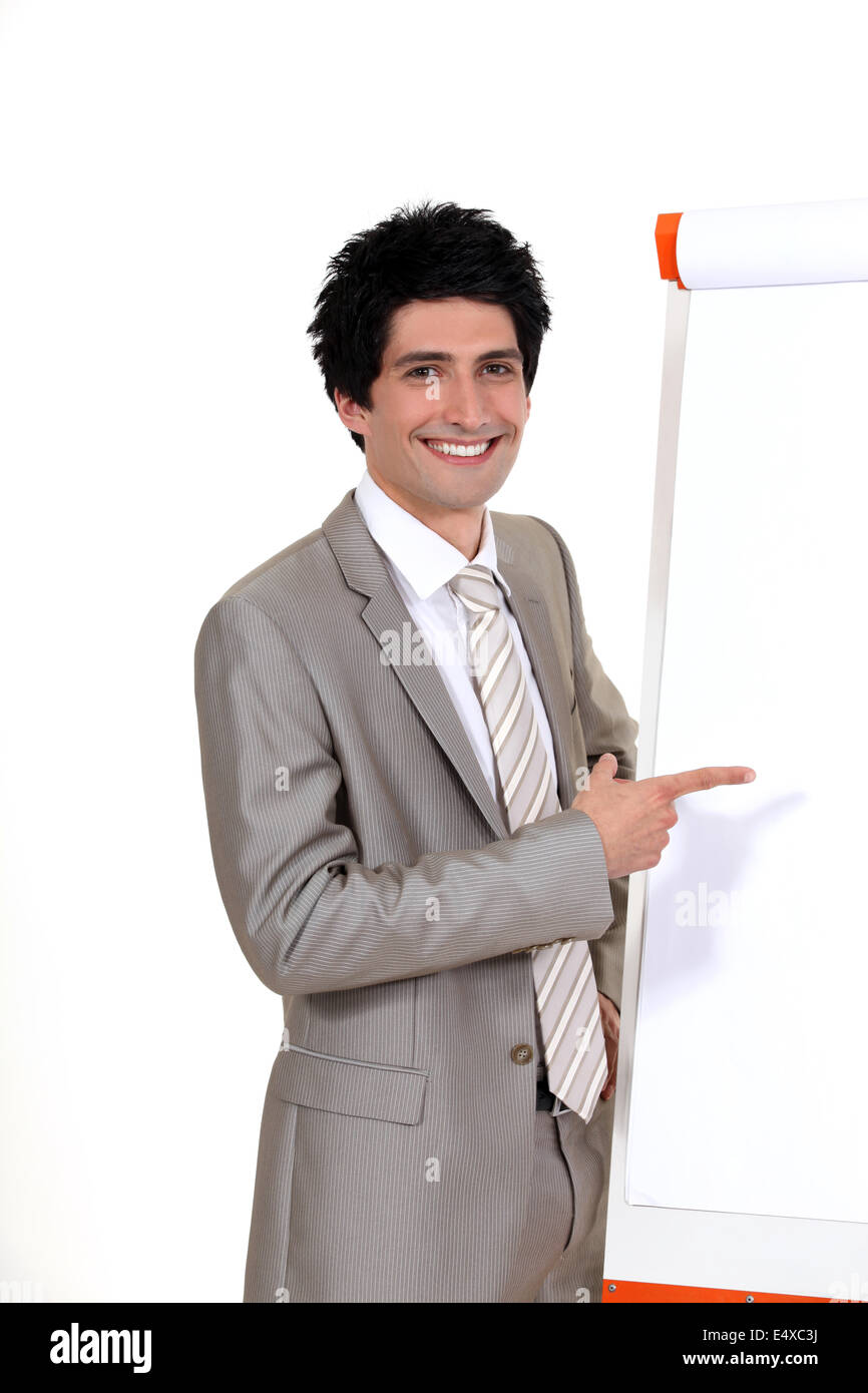 Young businessman pointing paper hi-res stock photography and images ...