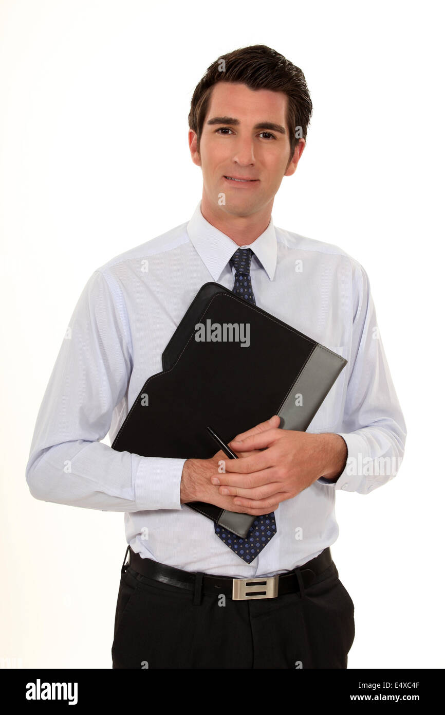 Confident businessman holding folder Stock Photo - Alamy