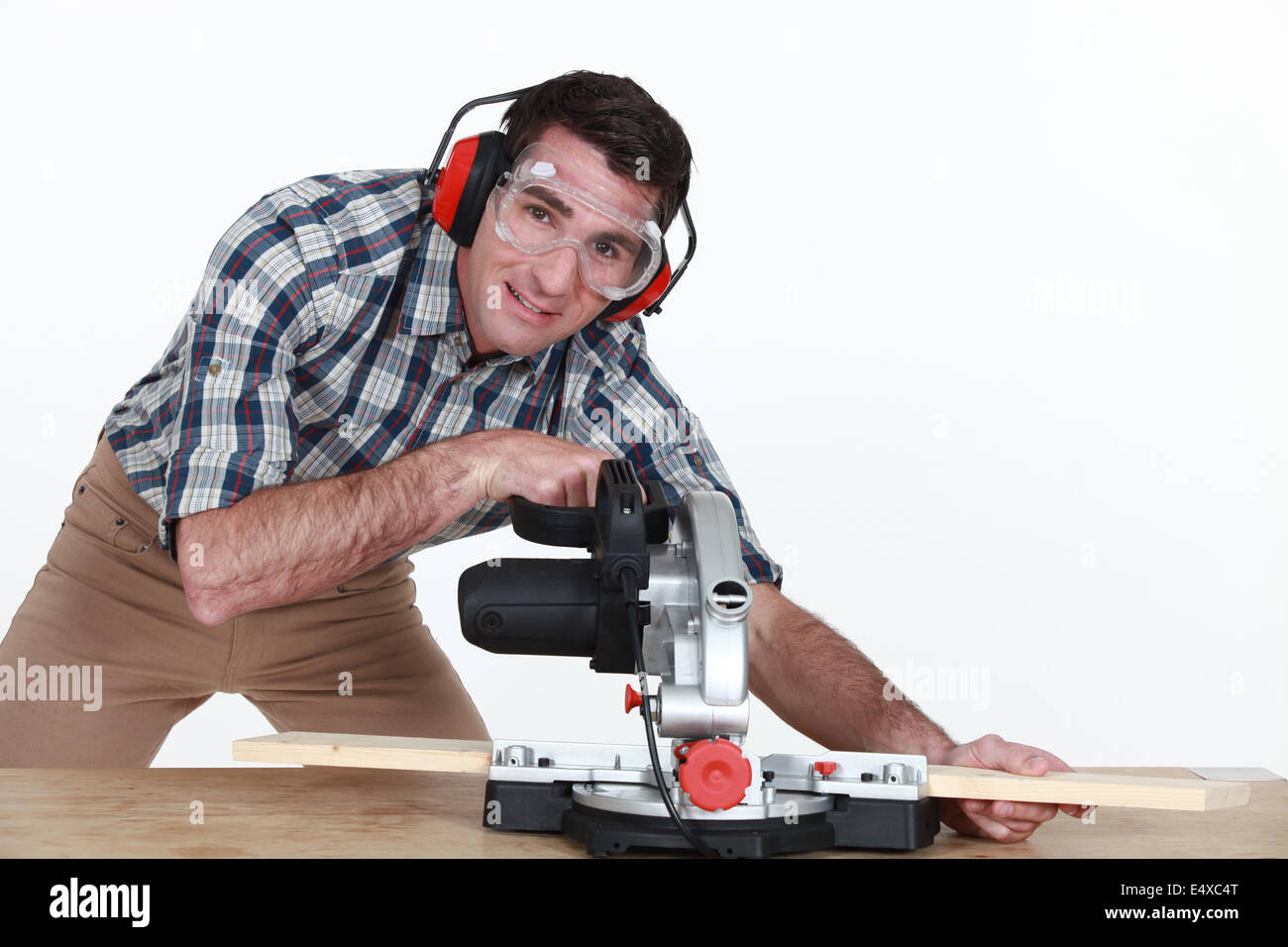 Man using a mitre saw Stock Photo - Alamy