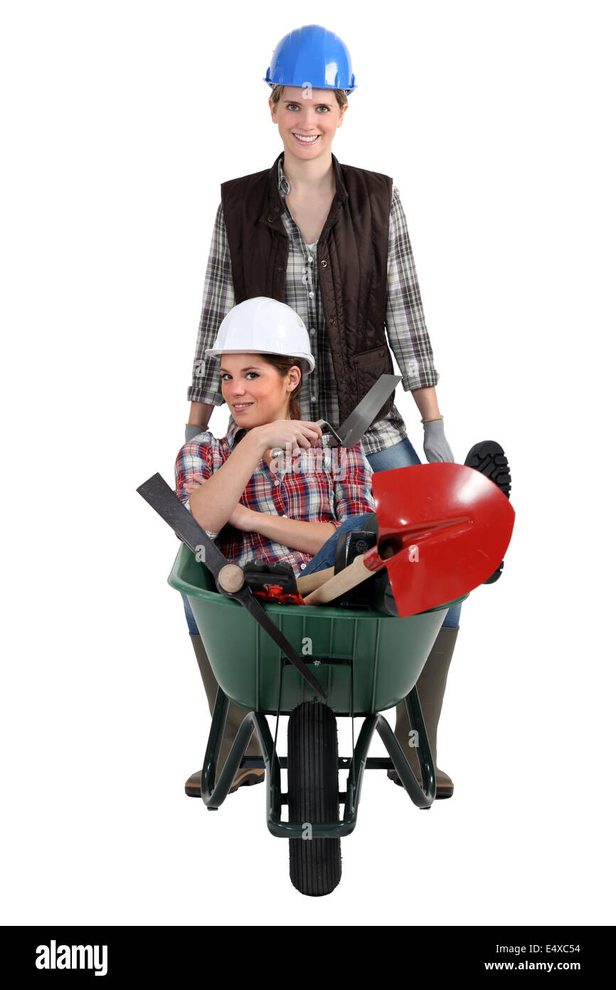 Woman being pushed in wheelbarrow Stock Photo - Alamy
