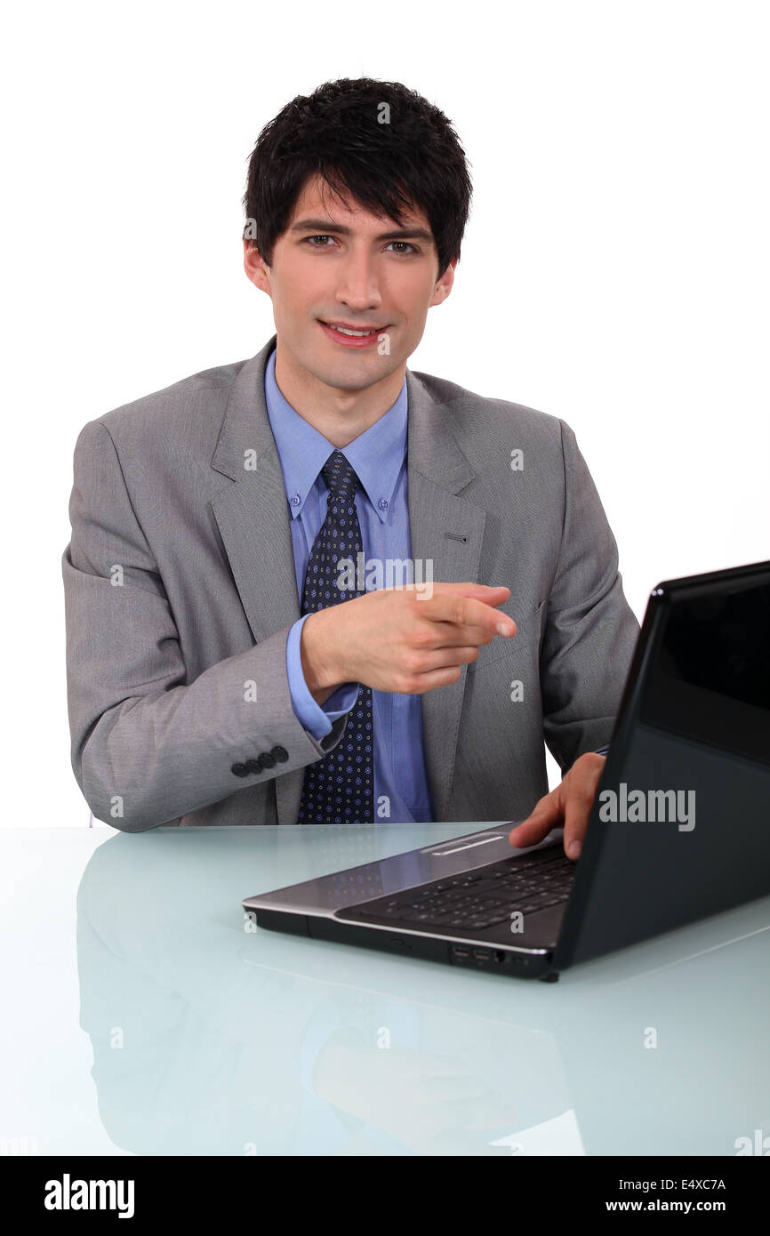 Businessman pointing at laptop hi-res stock photography and images - Alamy