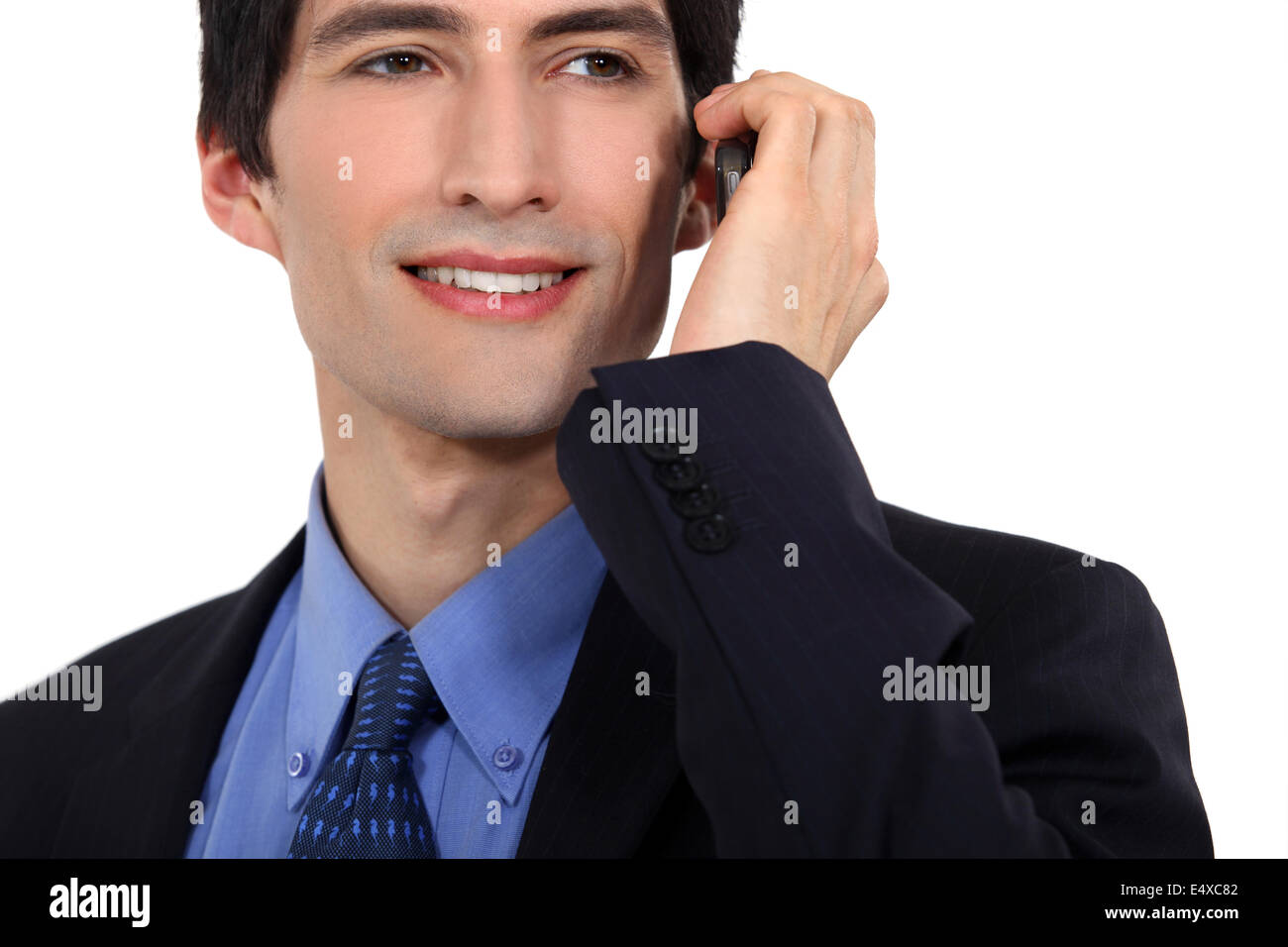 Young businessman using mobile telephone Stock Photo - Alamy