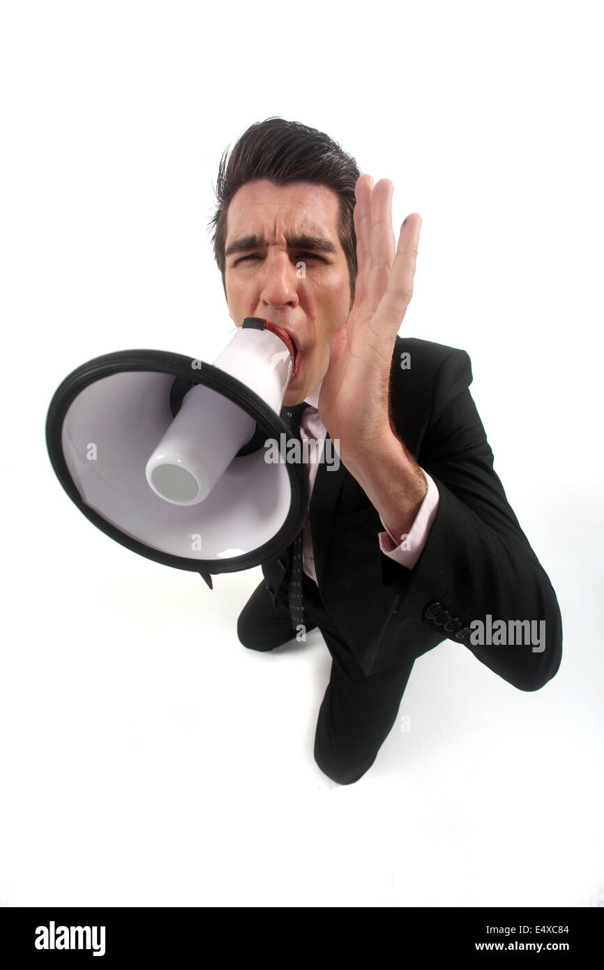 Businessman shouting through megaphone Stock Photo - Alamy