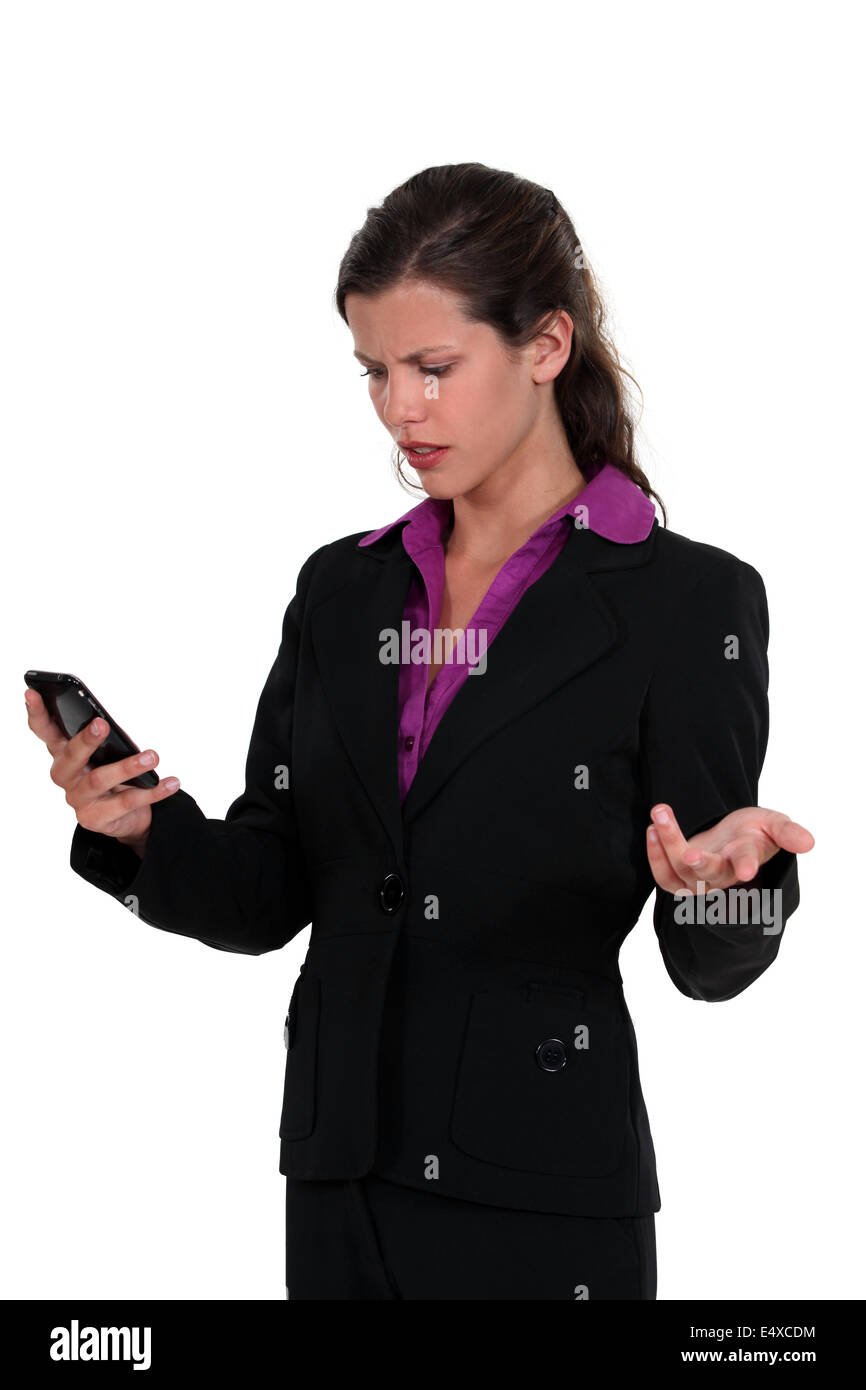 Angry woman reading a text message Stock Photo - Alamy