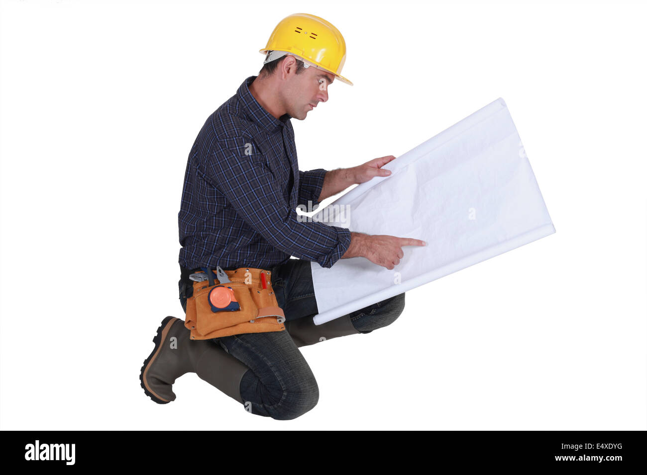 Engineer reading plans Stock Photo - Alamy