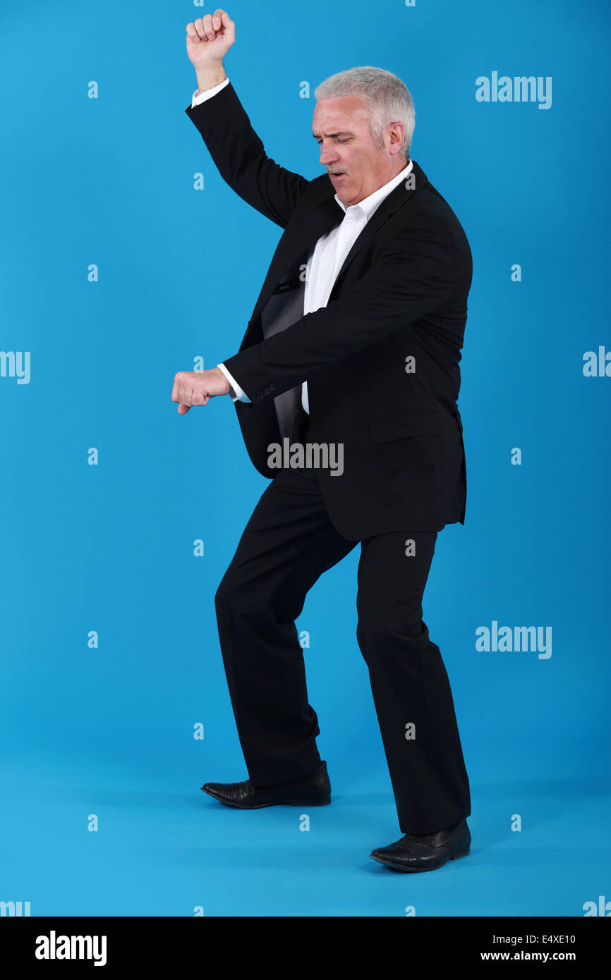 mature businessman dancing Stock Photo - Alamy