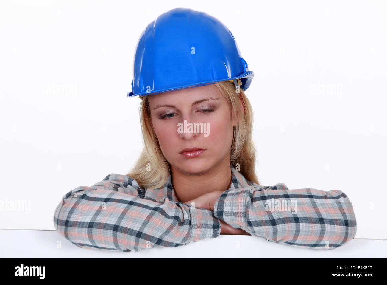 Tired female builder Stock Photo - Alamy