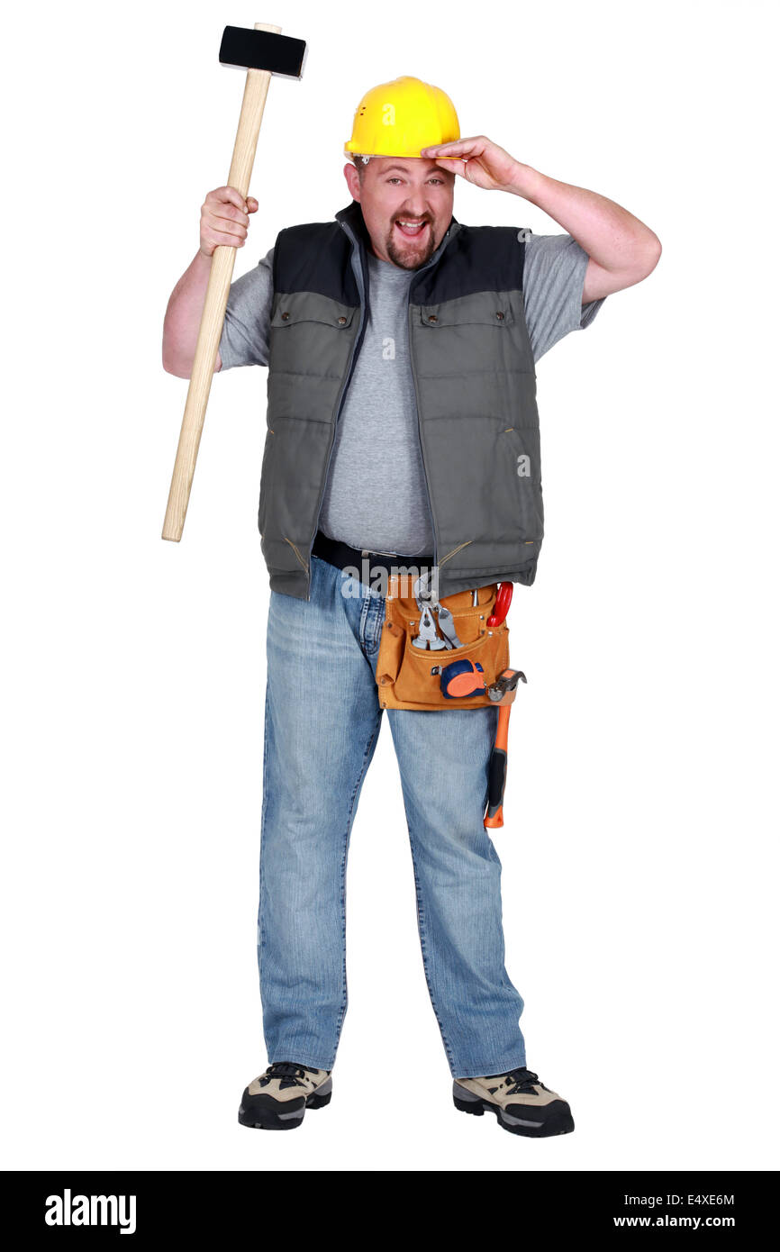 Man with sledge hammer tired after hard day Stock Photo - Alamy