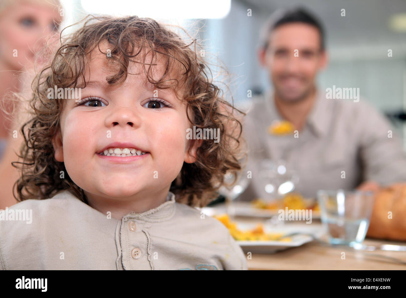 Little kid at kitchen table Stock Photo - Alamy