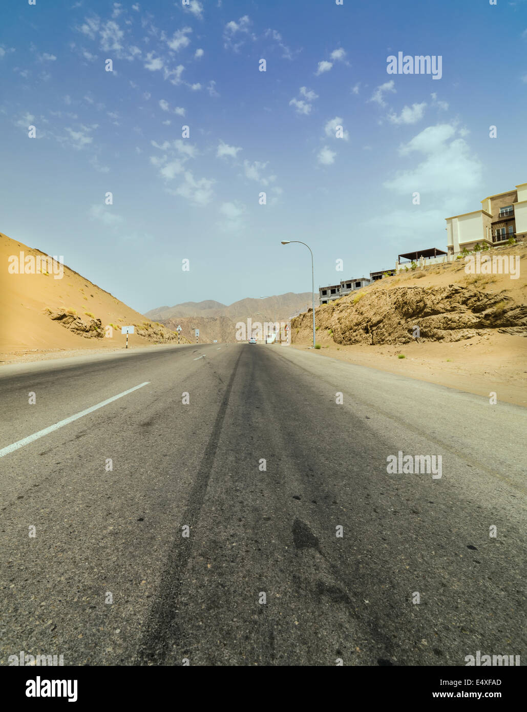 Paved road in over a hill in Muscat Oman Stock Photo - Alamy