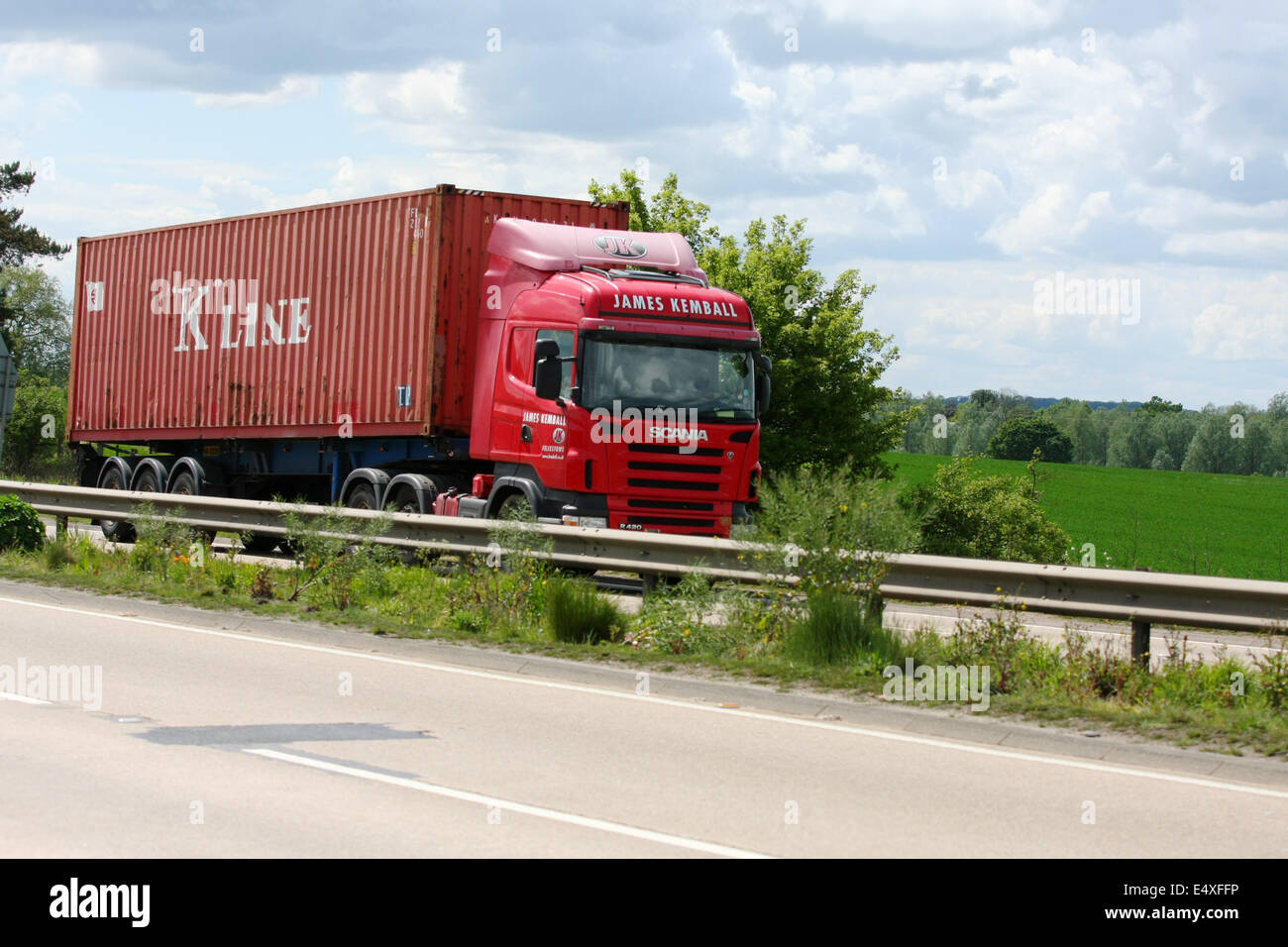 A James kemball Scania truck hauling a K Line shipping container along ...