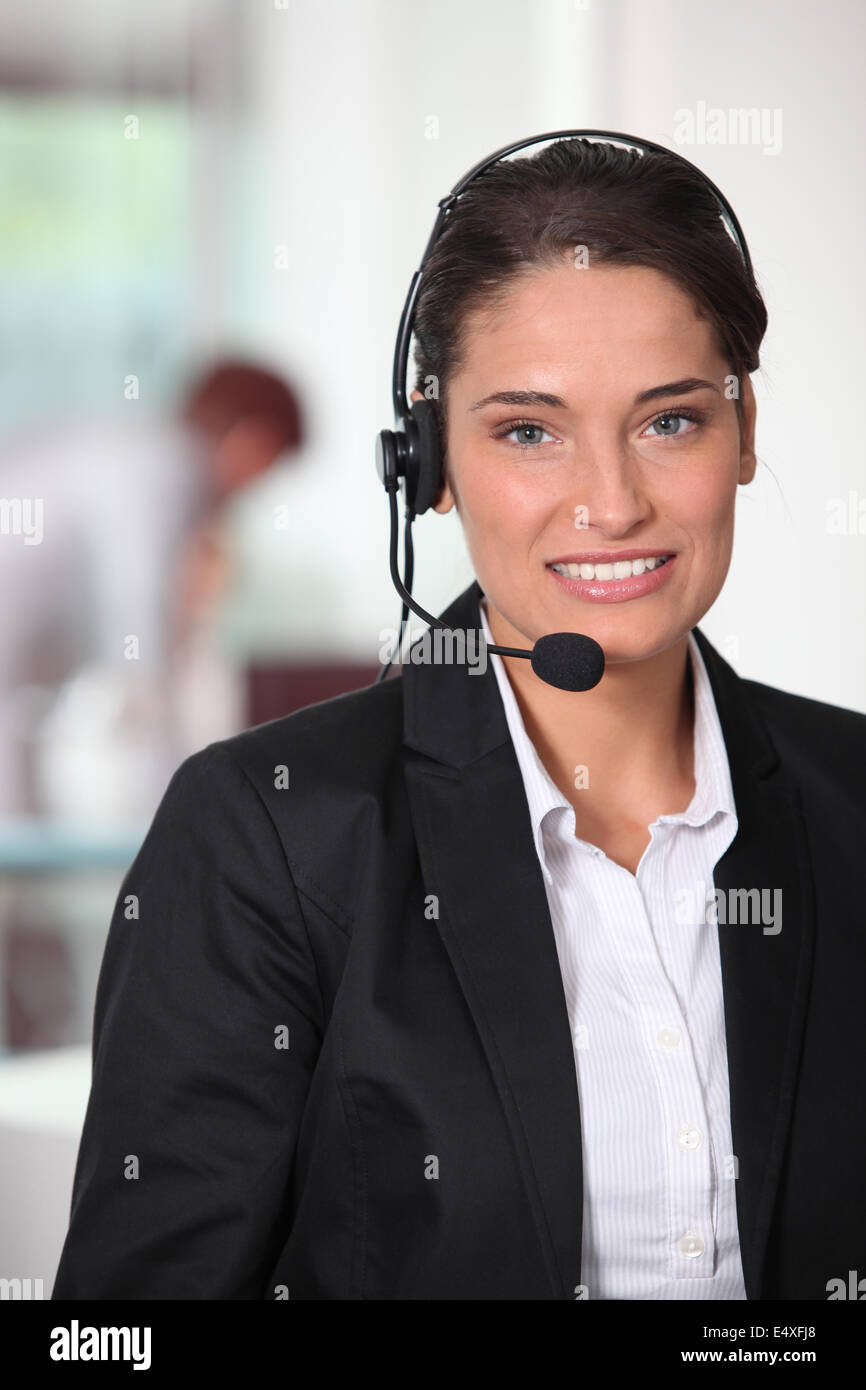 Customer service woman smiling Stock Photo - Alamy