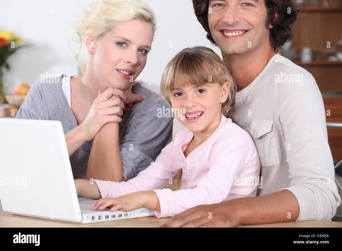 Parents teaching their child computer skills Stock Photo - Alamy