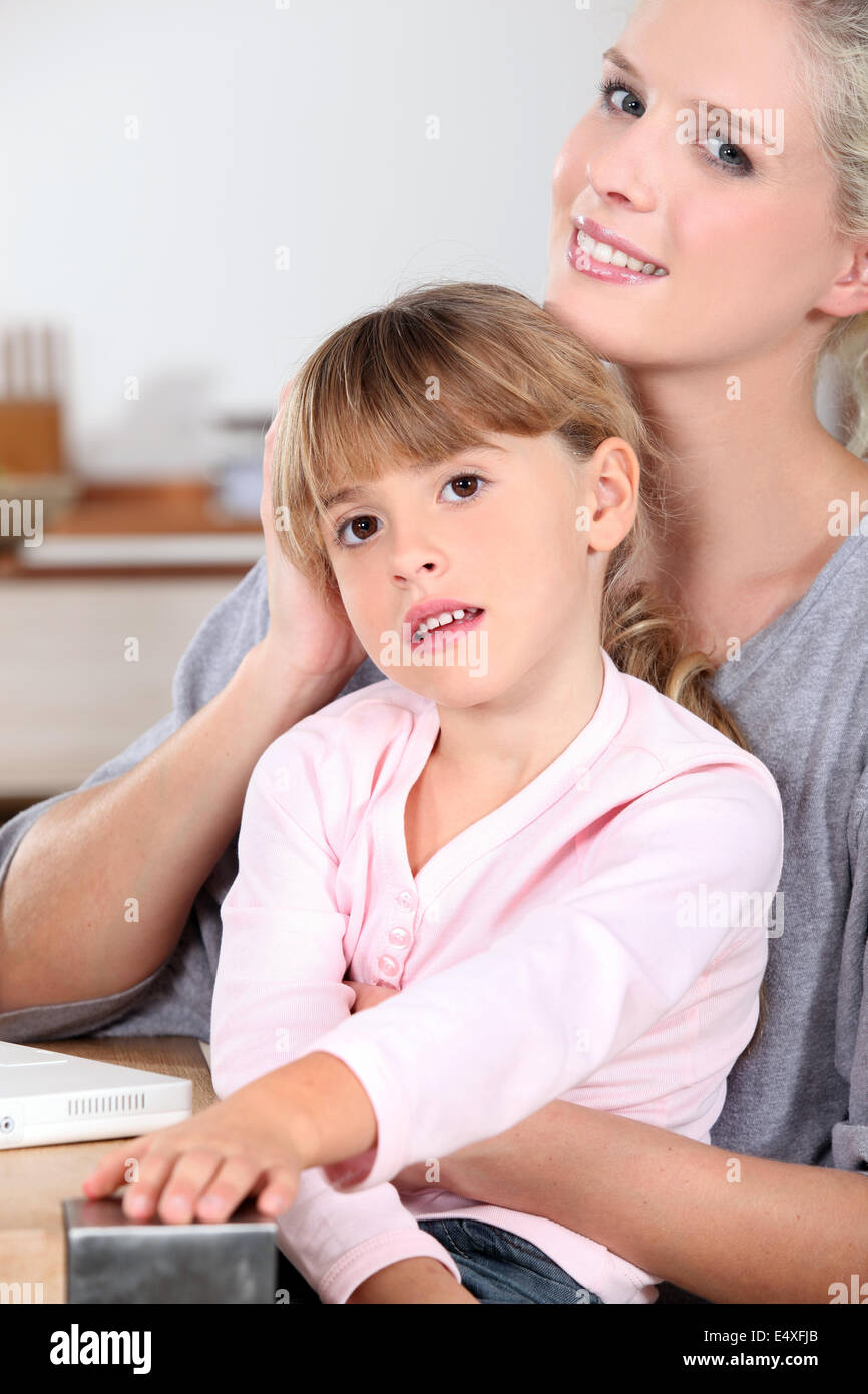 superb blonde with little girl Stock Photo - Alamy