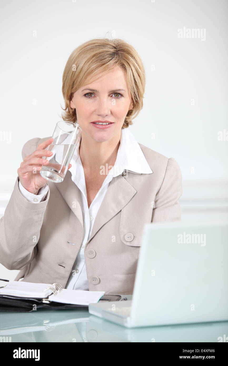 Woman computer desk drinking water hi-res stock photography and images ...