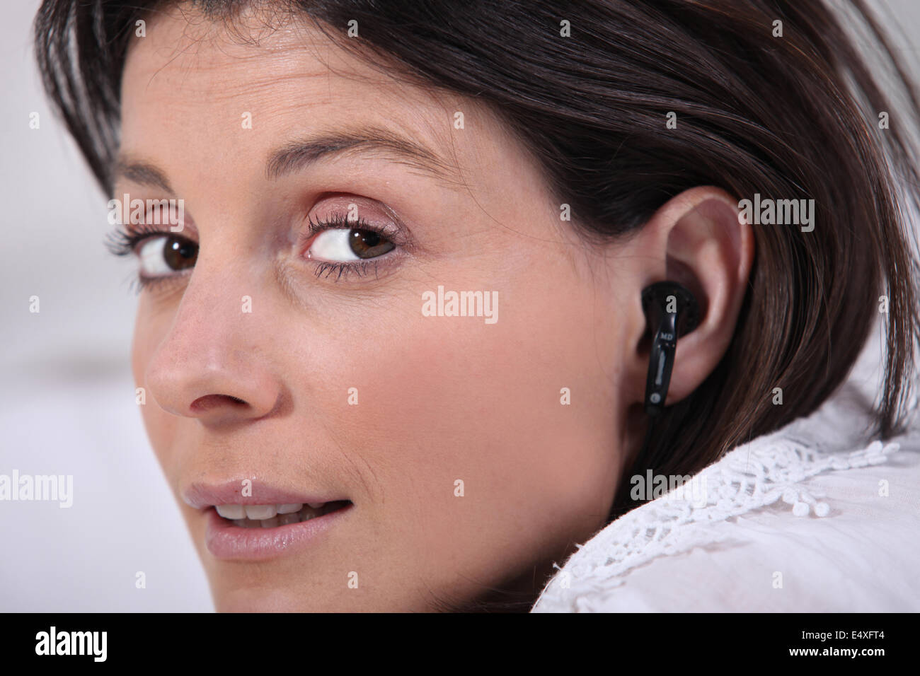 Woman wearing earphones Stock Photo - Alamy