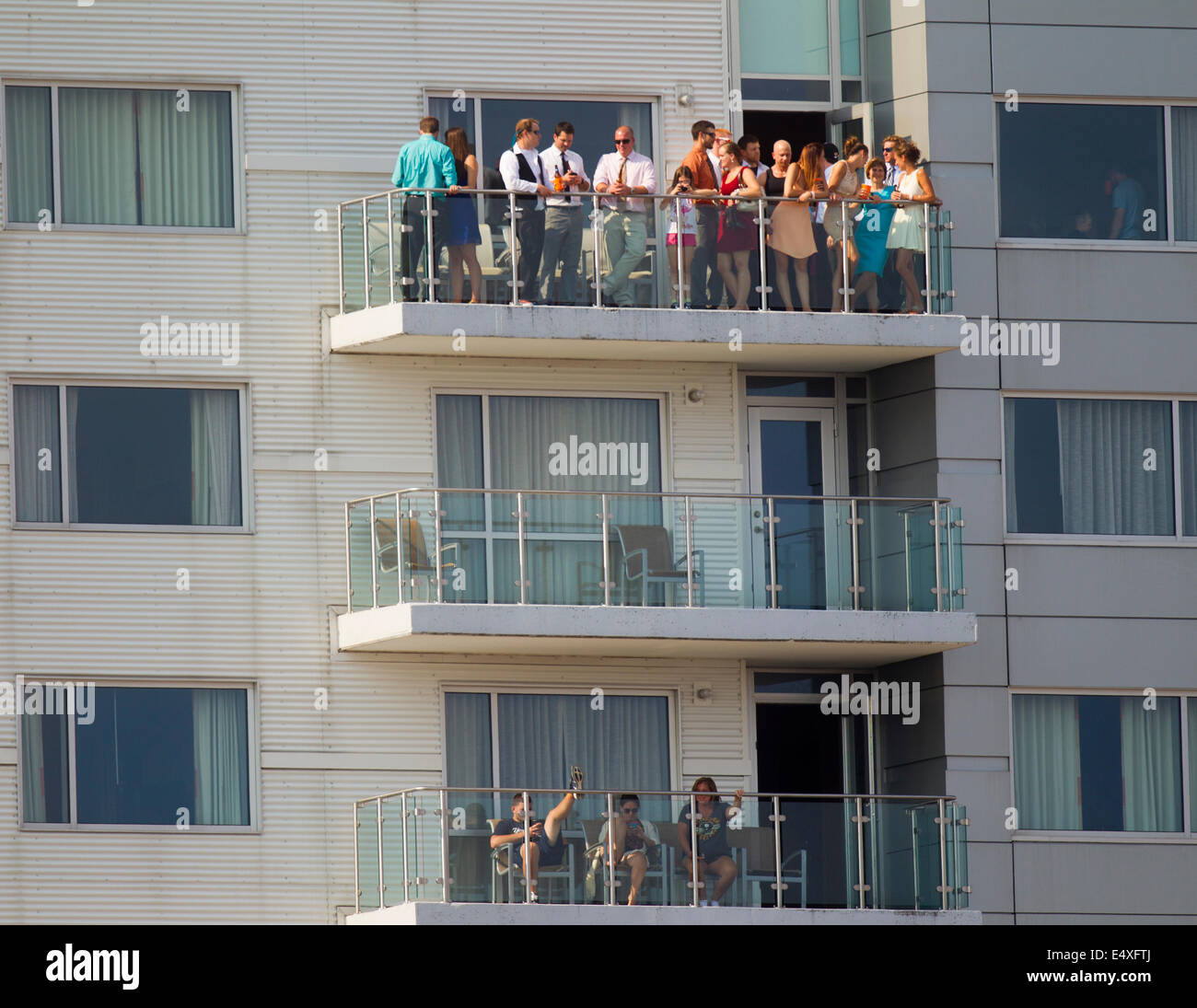 People on the balcony of a high rise building Stock Photo - Alamy